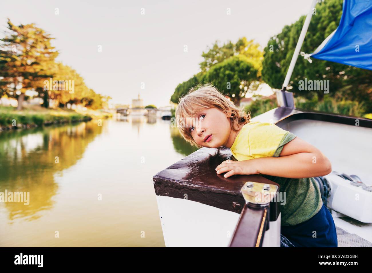 Cute little boy sailing on the boat. Image taken in Aigues-Mortes ...