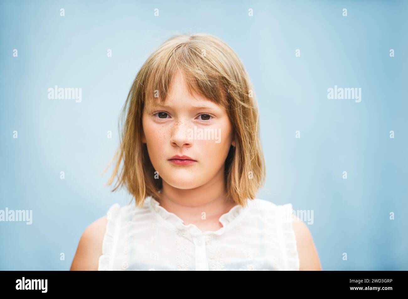 Close up portrait of adorable little girl with short bob haircut ...