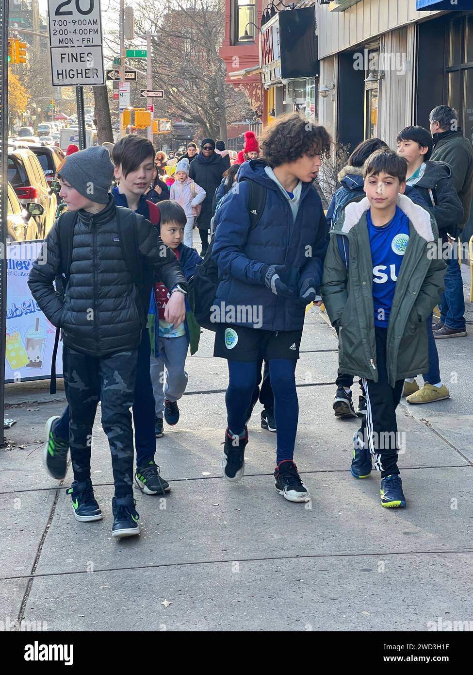 Boys walking home after school along 7th Avenue in the Park Slope ...