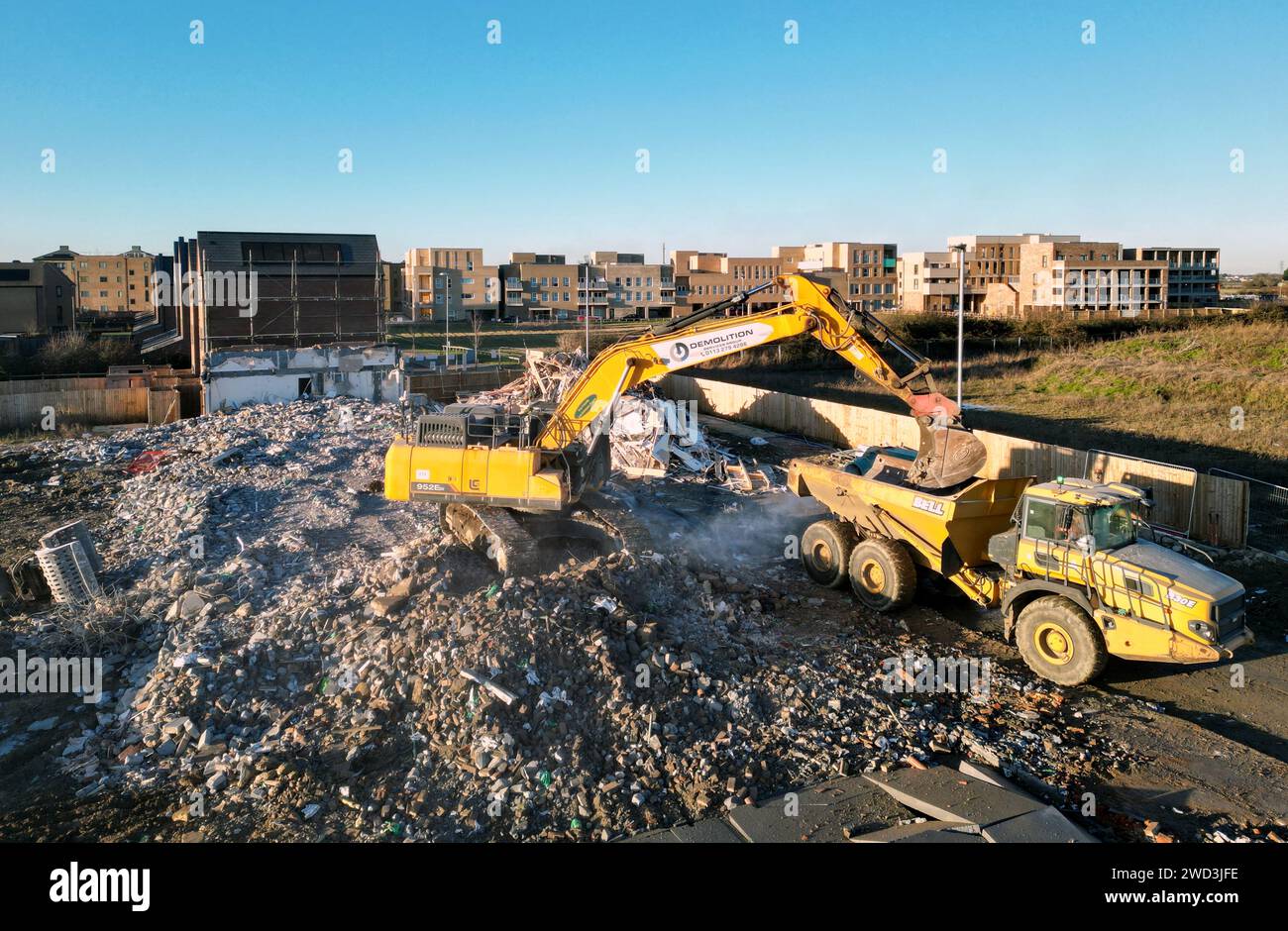 Demolition begins on new homes at the Darwin Green development in Cambridge due to problems with ...