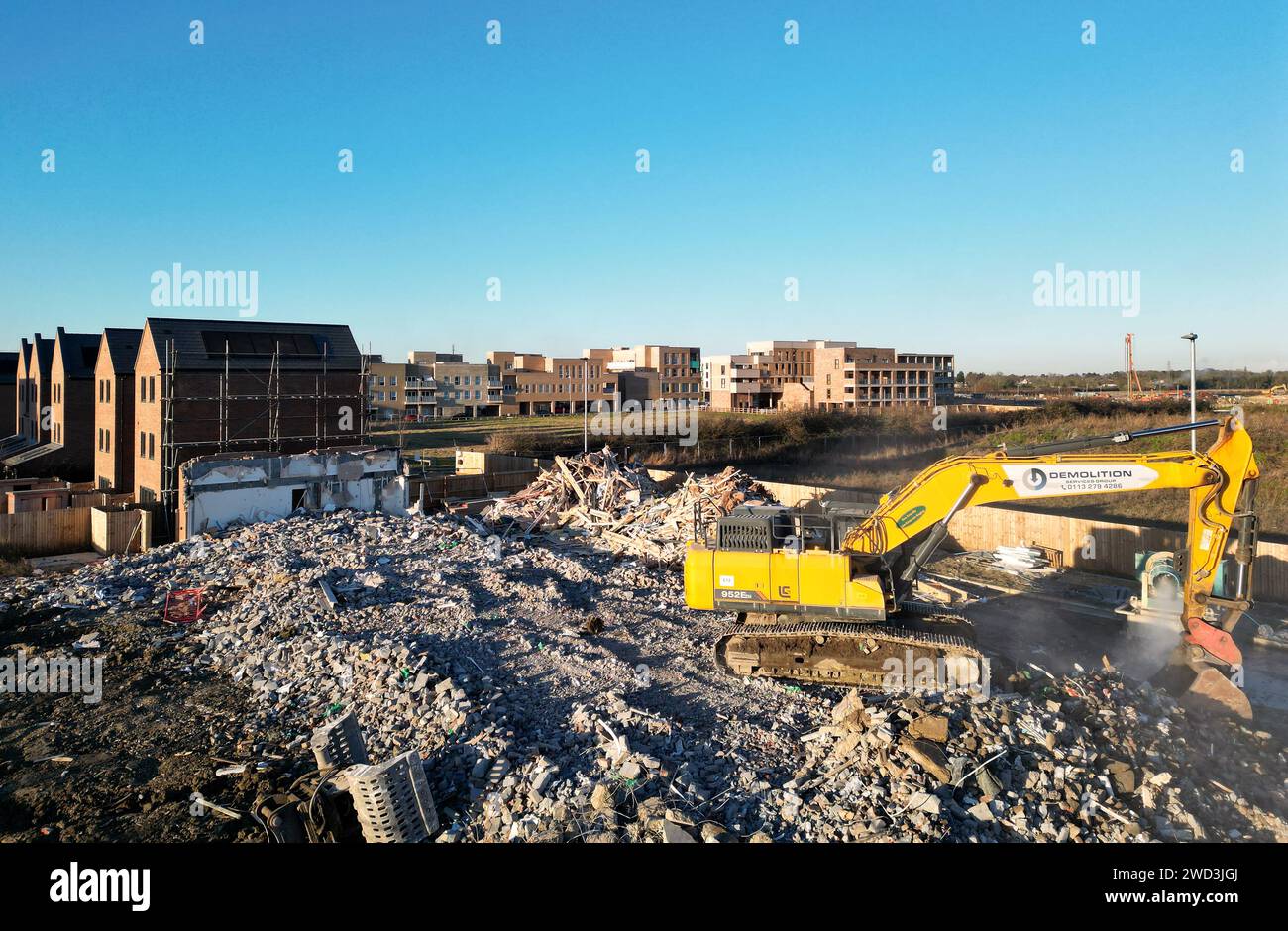 Demolition begins on new homes at the Darwin Green development in Cambridge due to problems with ...