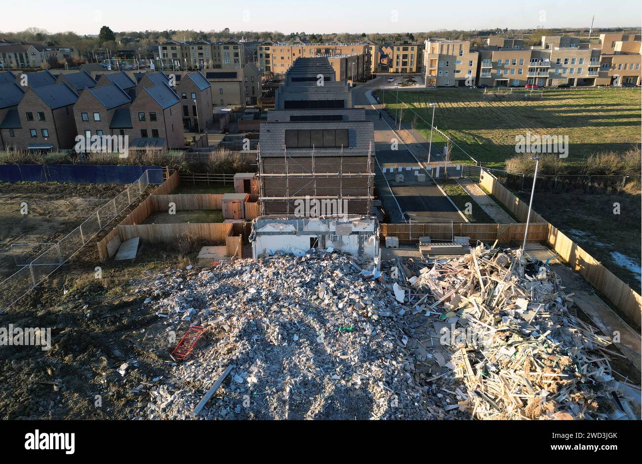 Demolition begins on new homes at the Darwin Green development in Cambridge due to problems with ...