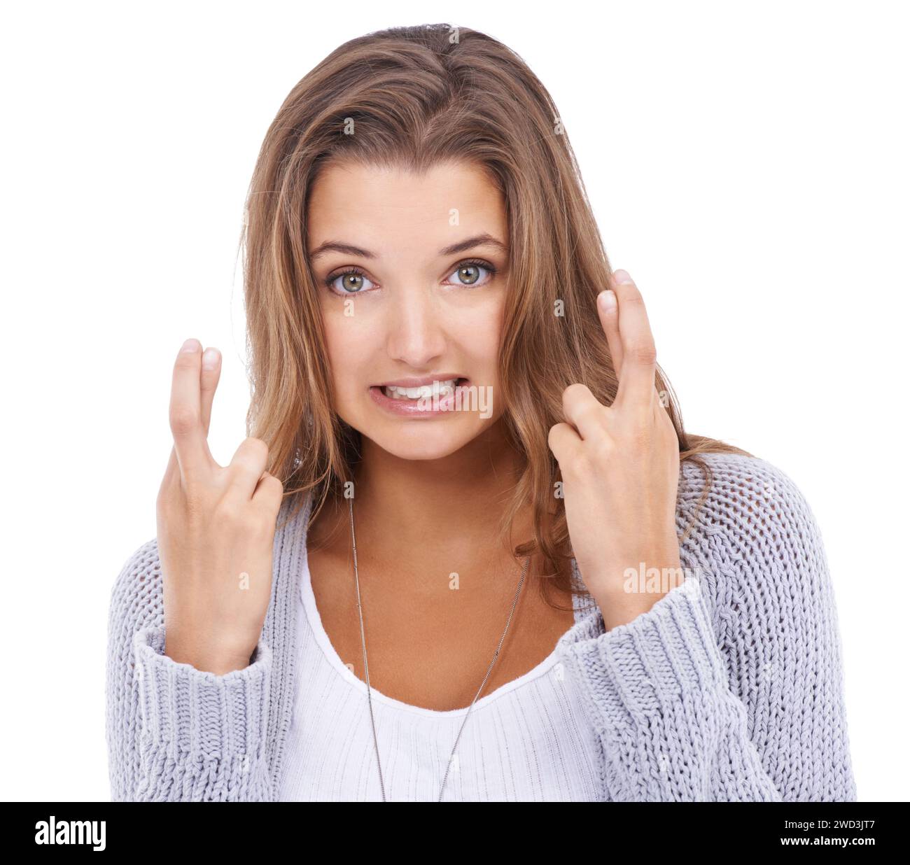 Nervous woman, portrait and hope with fingers crossed in studio for ...