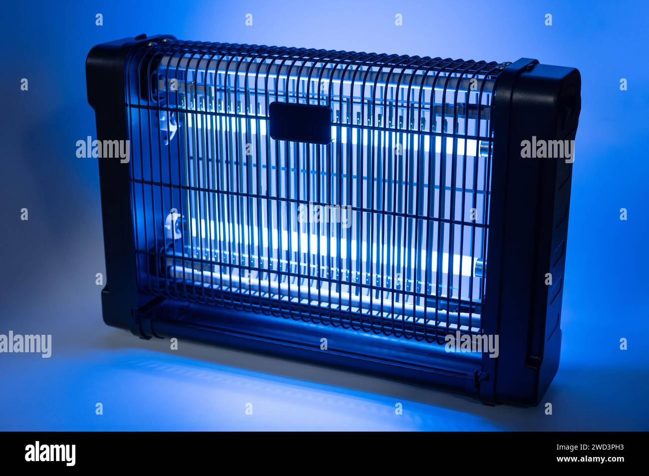 Anti mosquito lamp side view on blue studio background Stock Photo - Alamy