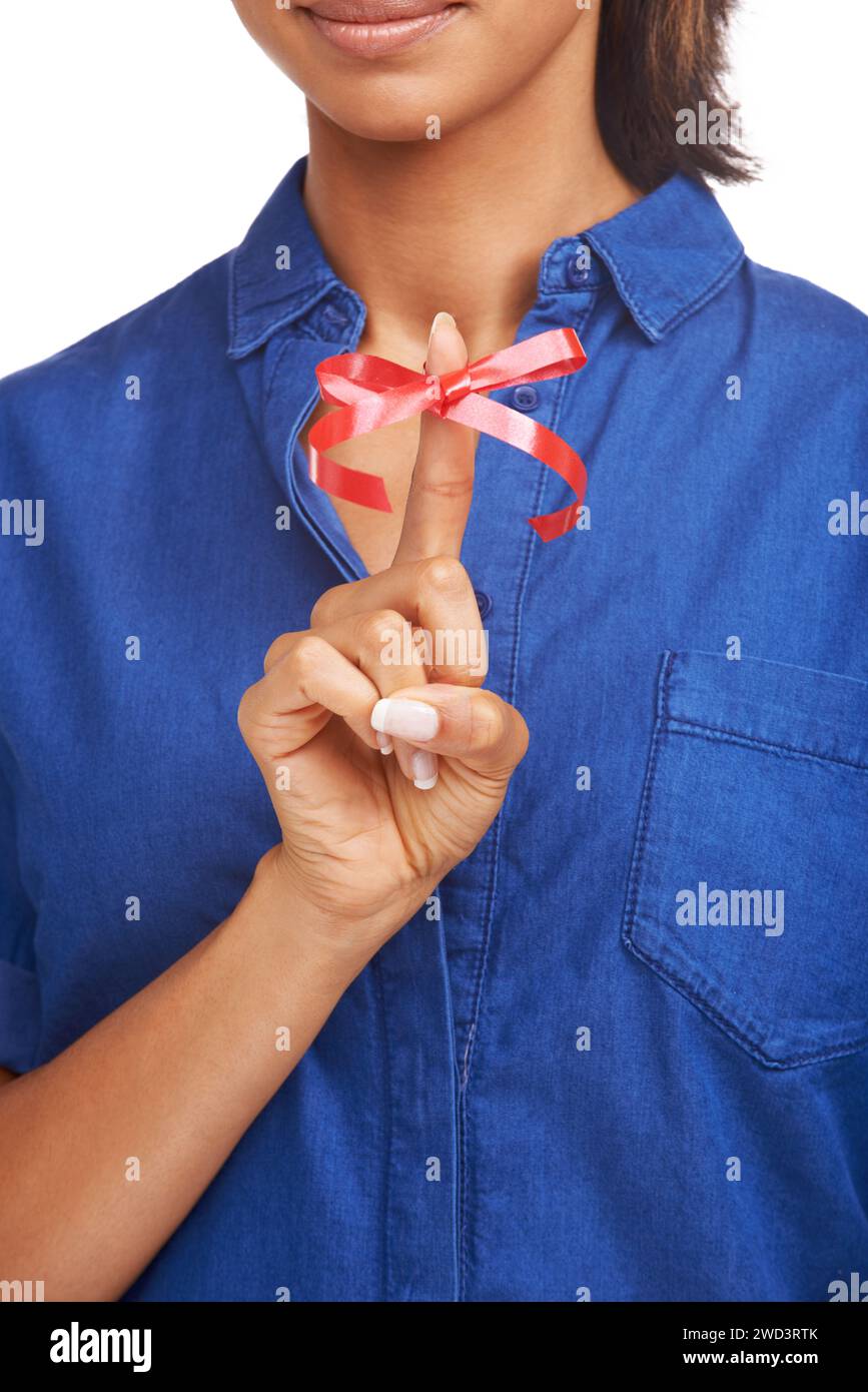 Red, ribbon and bow on finger for reminder of event, commitment or sign ...