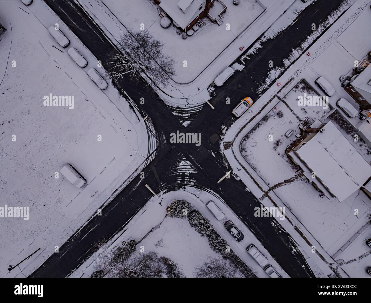 An aerial view over a residential neighborhood intersection on Long ...