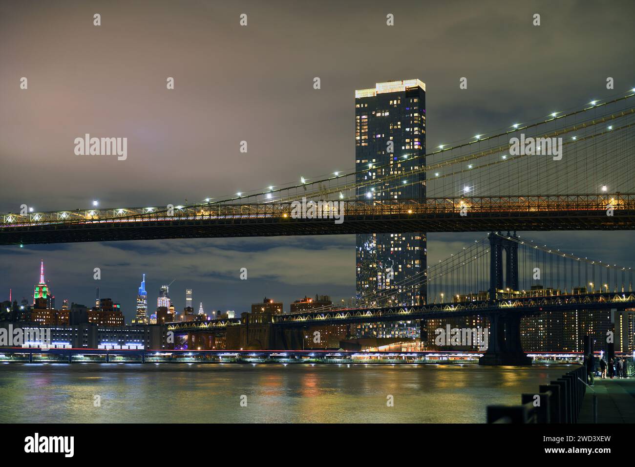 Brooklyn Bridge and Manhattan Bridge at night in winter, suspension ...