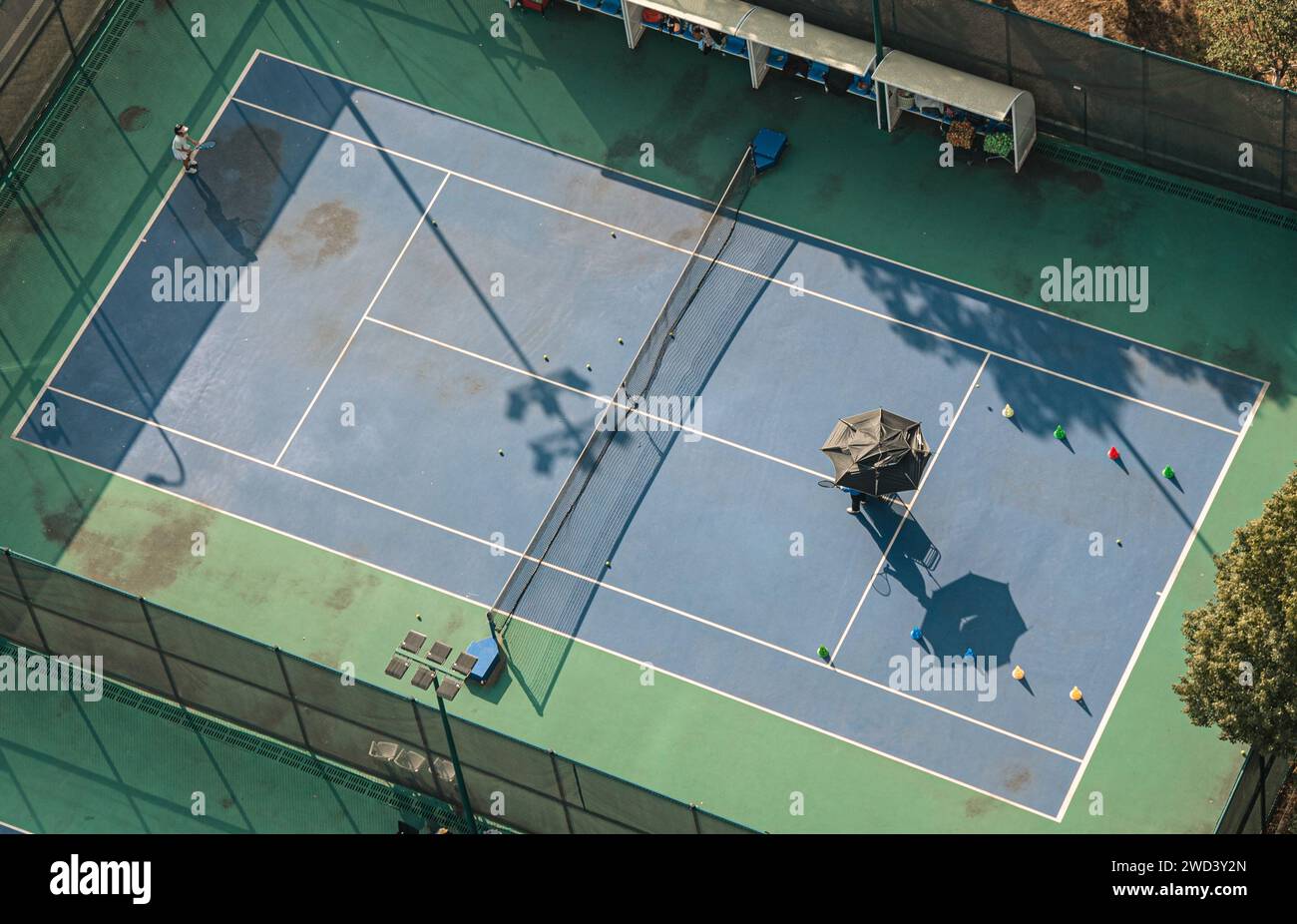 Aerial shot of tennis court with active youth Stock Photo - Alamy