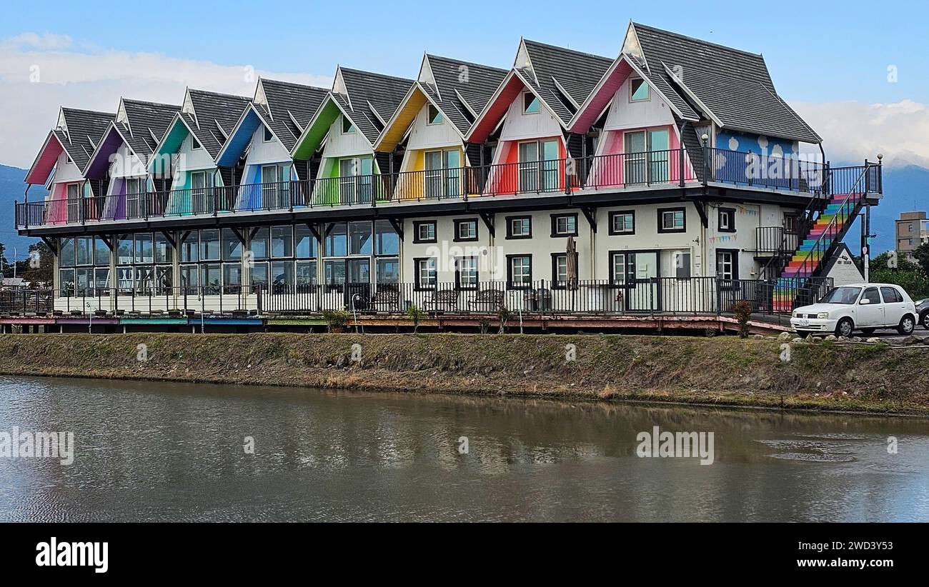 The colorful houses line the train tracks, creating a beautiful ...