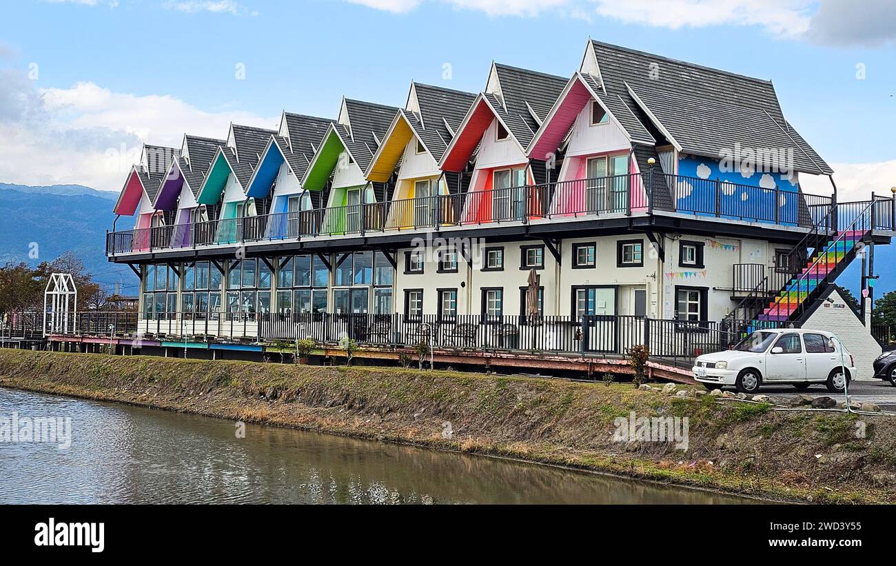 The colorful houses line the train tracks, creating a beautiful ...