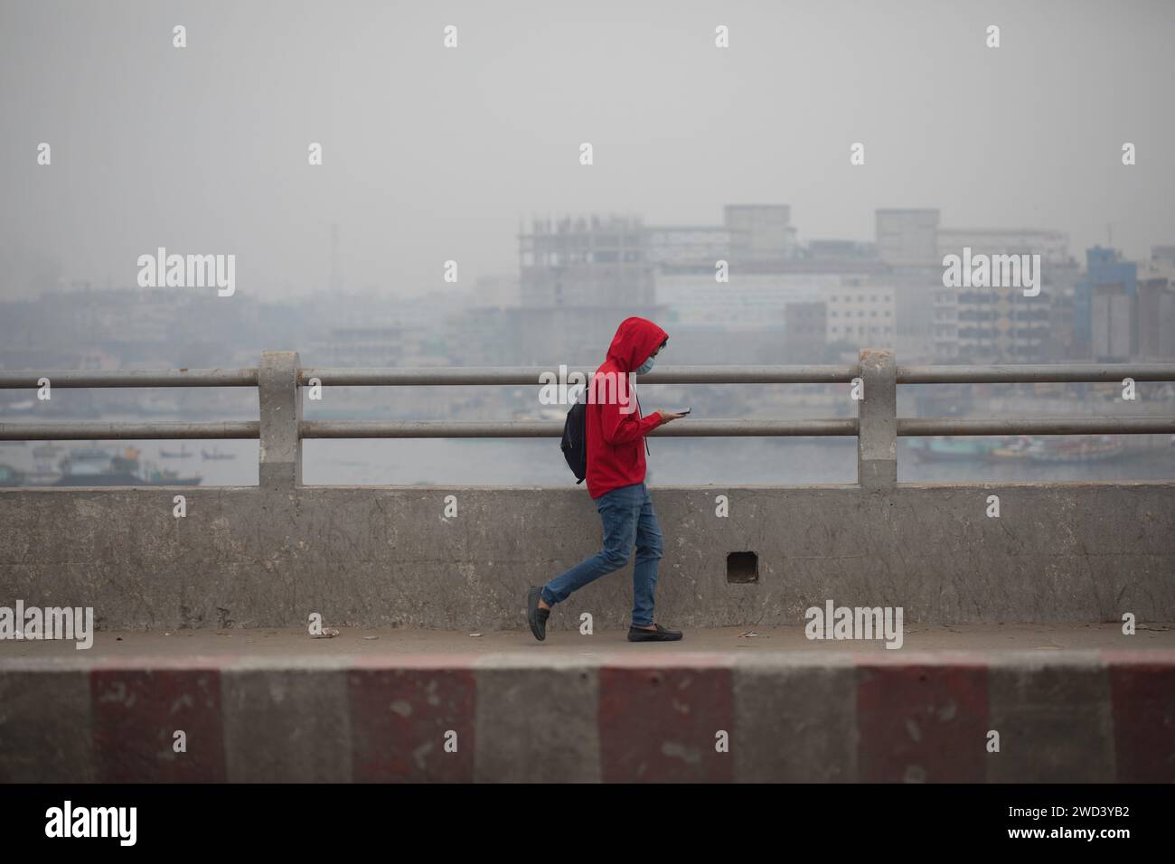 Dhaka, Bangladesh. 18th Jan, 2024. A man seen walking in Sadarghat ...