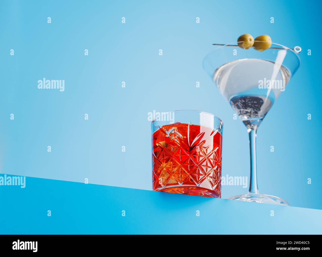 Cocktail delight: Vibrant drinks against a cool blue background with ...