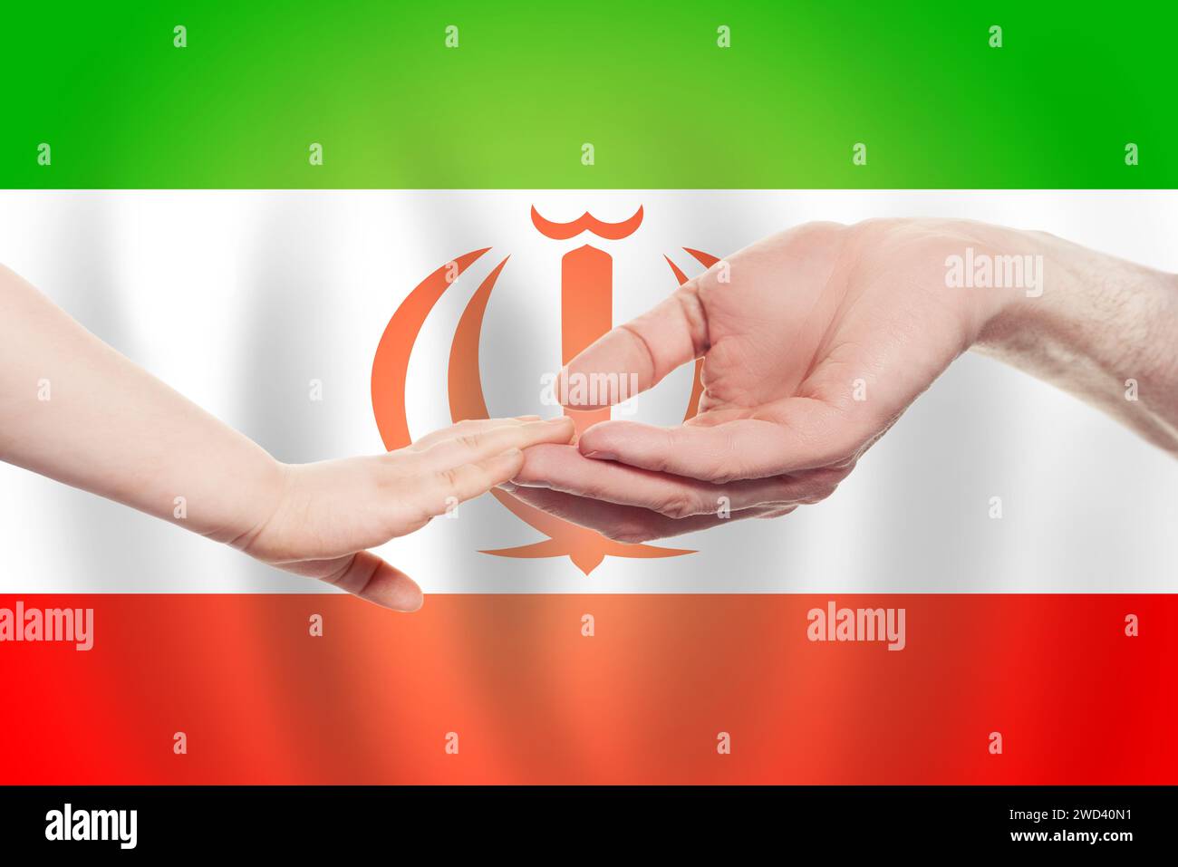 Irani baby and parent hands on the background of flag of Iran Help, aid, support, charity ...