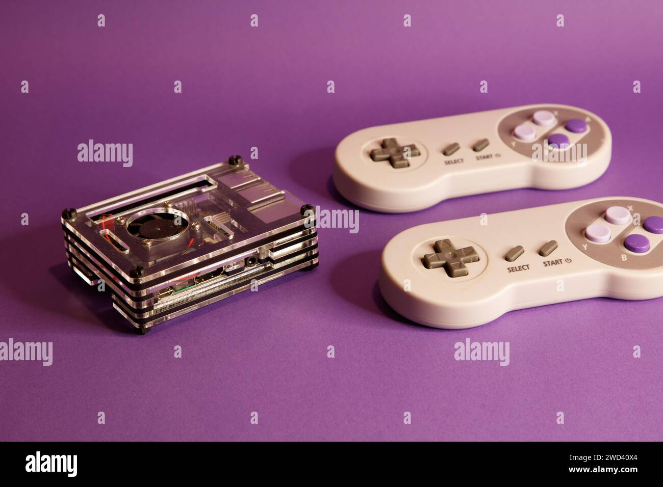 Nintendo type video game contollers and a Raspberry Pie computer, on a ...