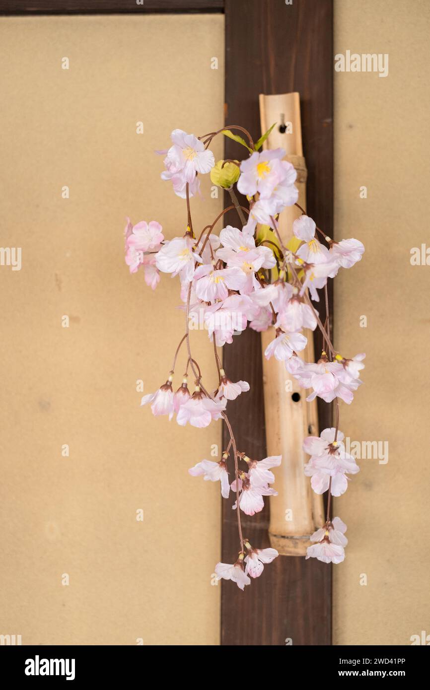 Faux cherry blossom flowers in a bamboo holder in the Nagamachi Samurai ...