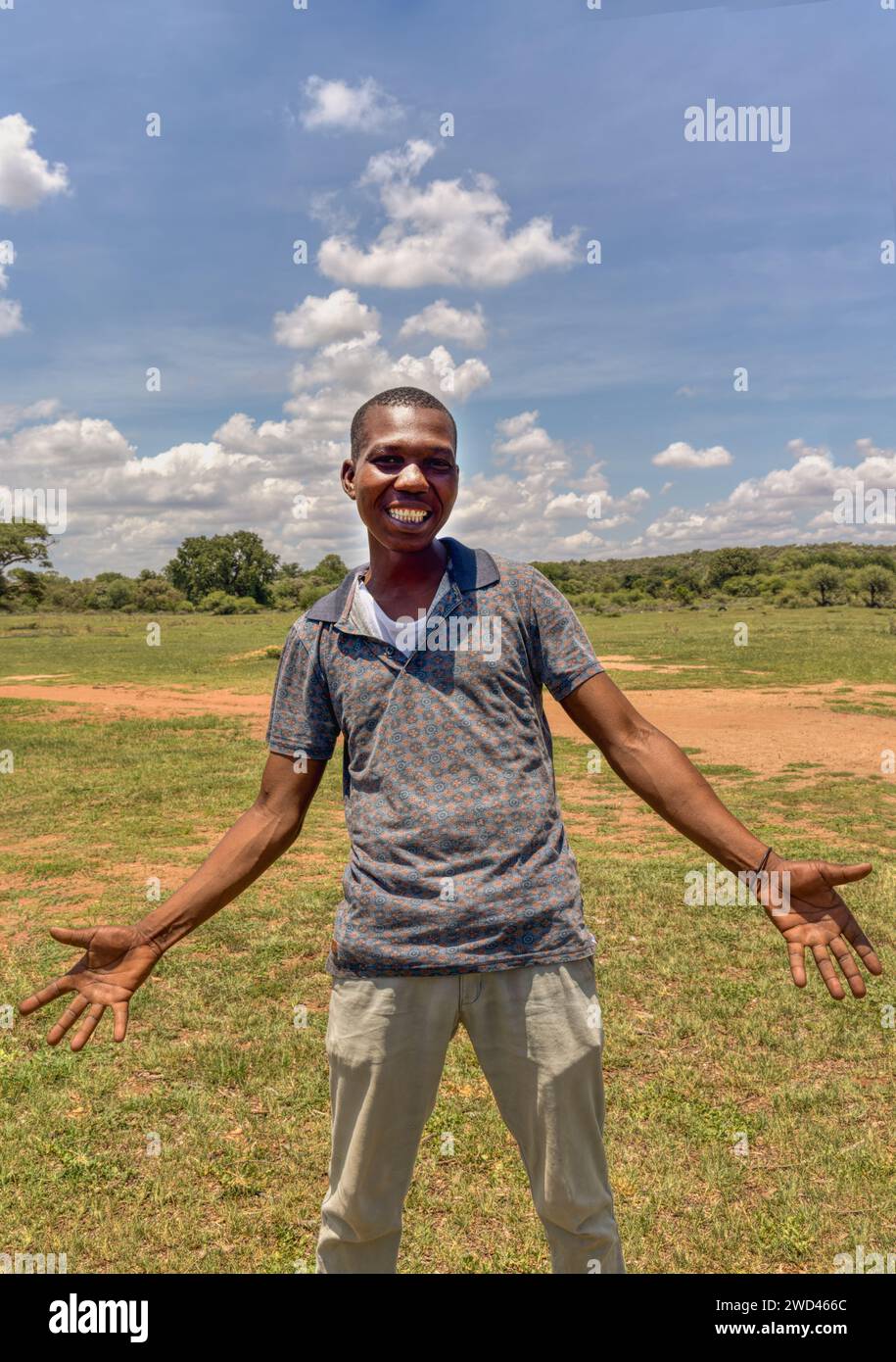 happy village young african man with a big toothy smile and open arms ...
