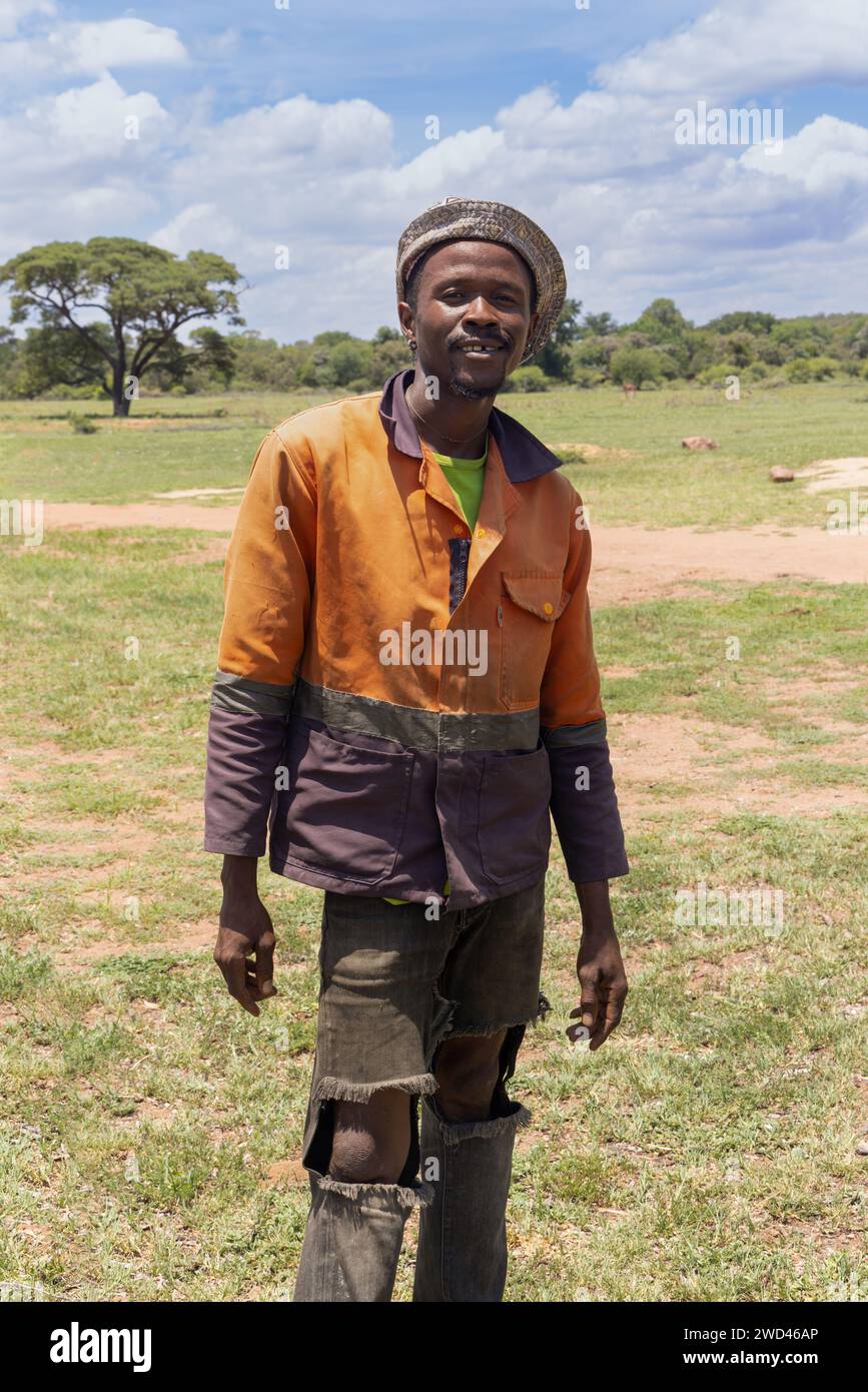 happy village young african man with a big toothy smile in the street ...