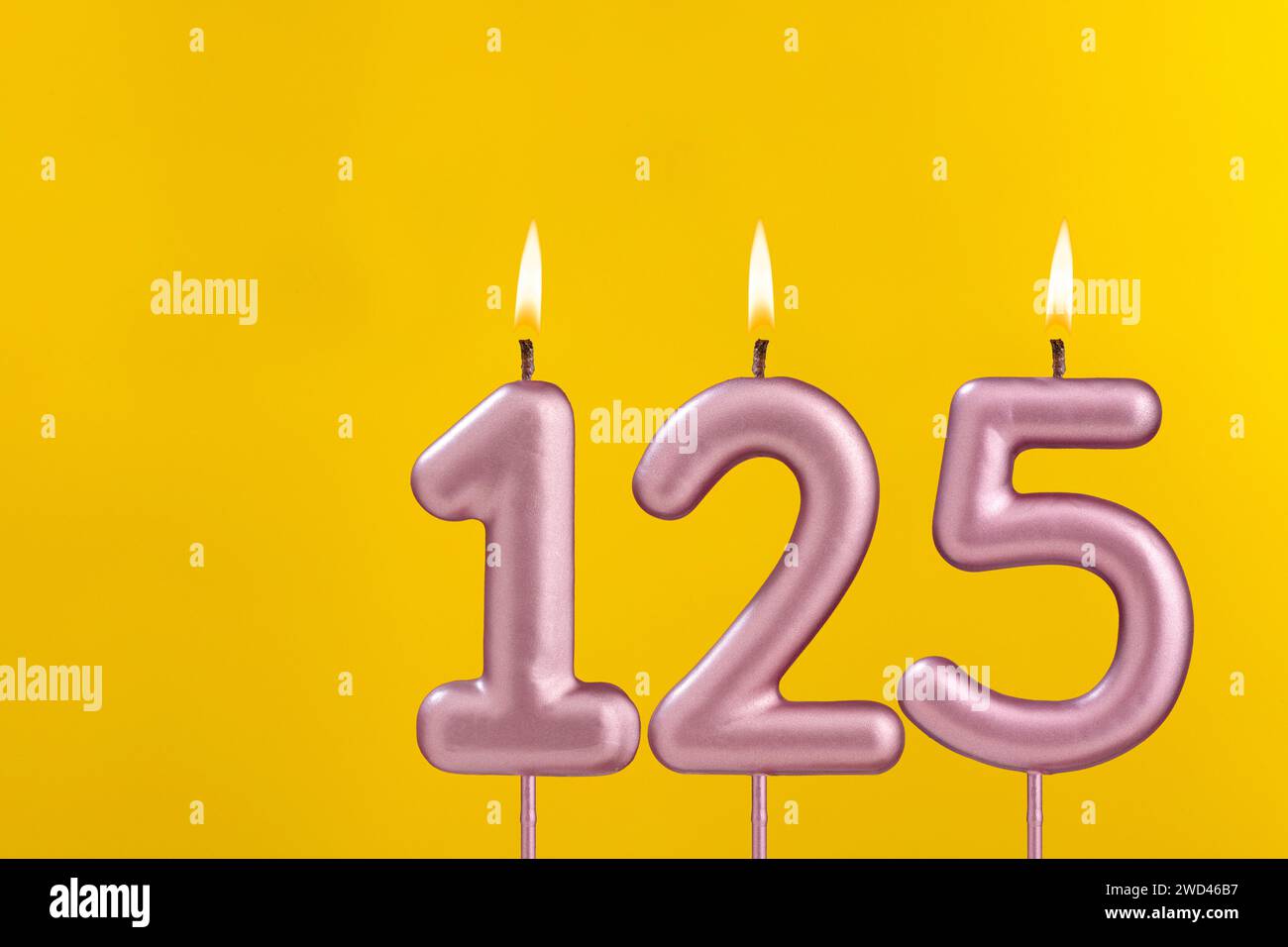 Birthday candle number 125 - Birthday celebration on yellow background ...