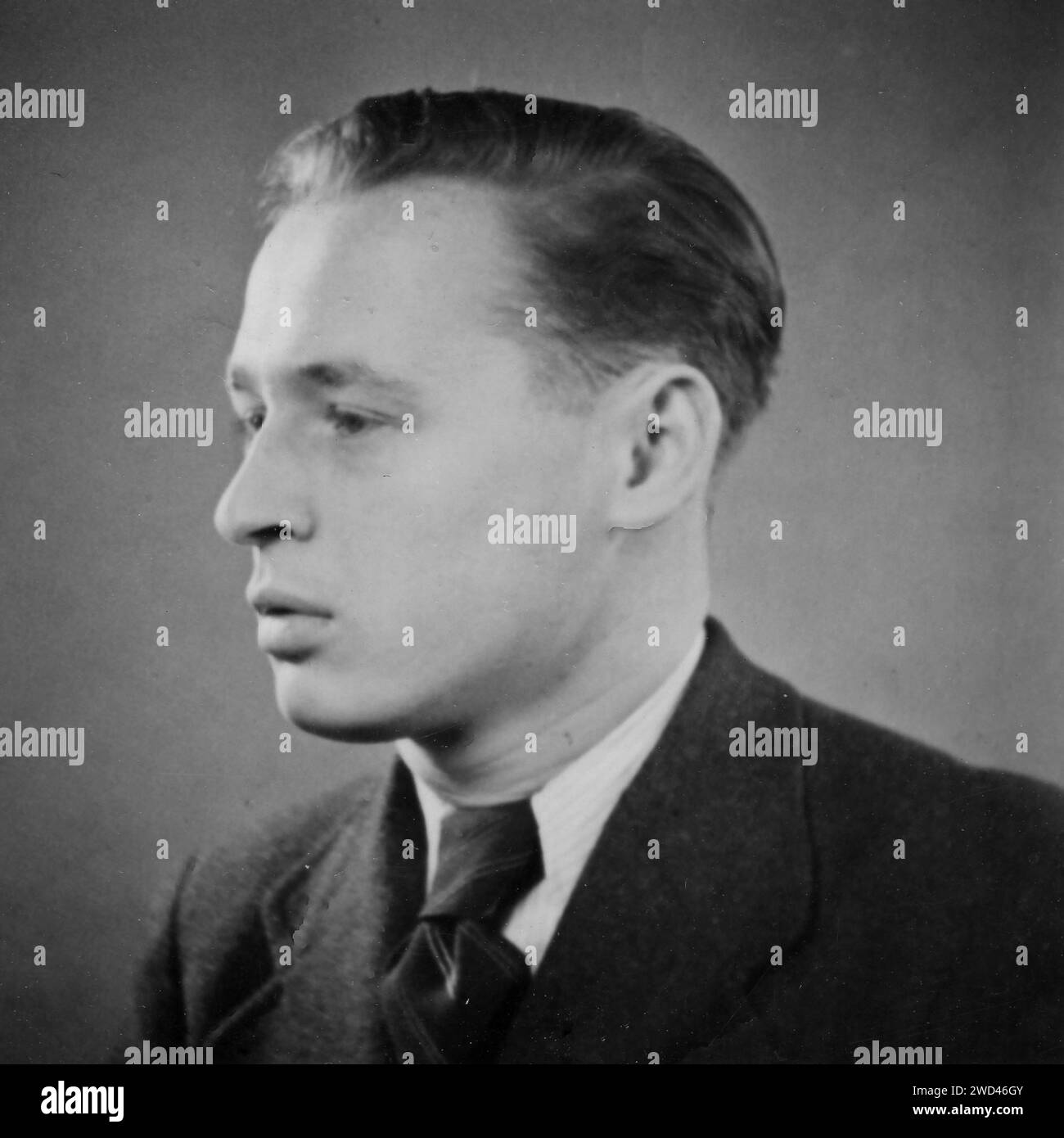 Antique photo shows a studio portrait of a young man in profile ...