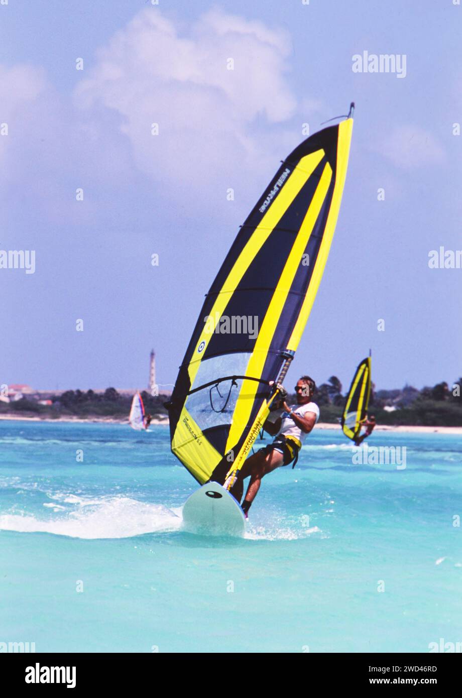 Man on vacation enjoying perfect weather conditions winsurfing ...