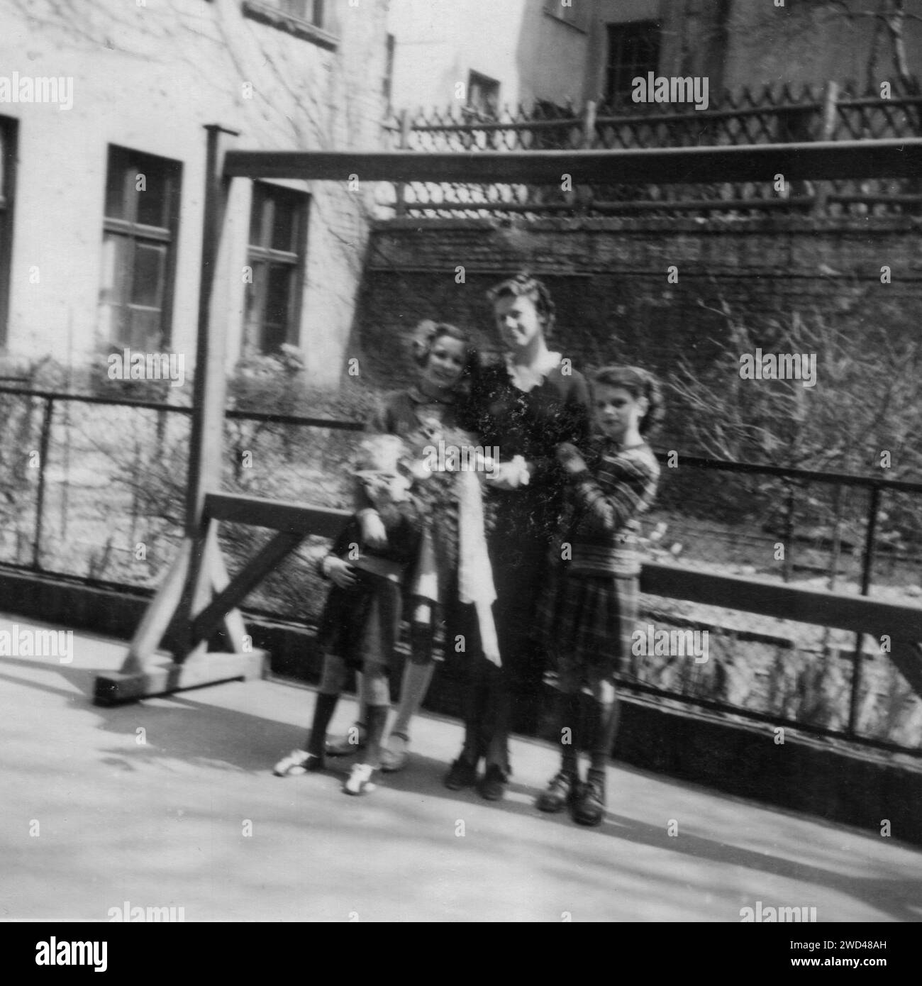 Antique photo shows three girls posing in front of a condo. Berlin ...