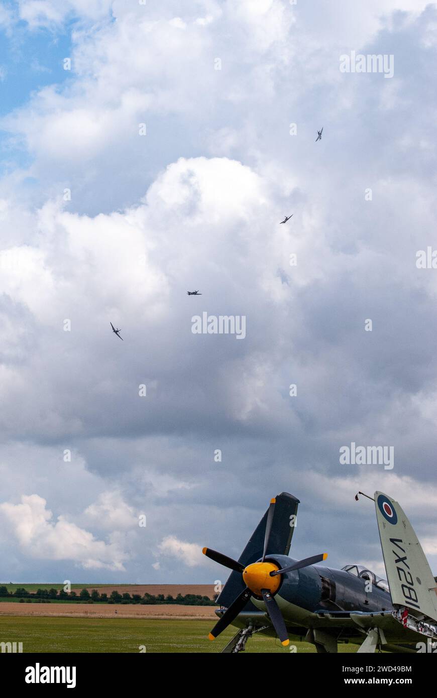Spitfire formation dogfight in the clouds at flying legends airshow in ...