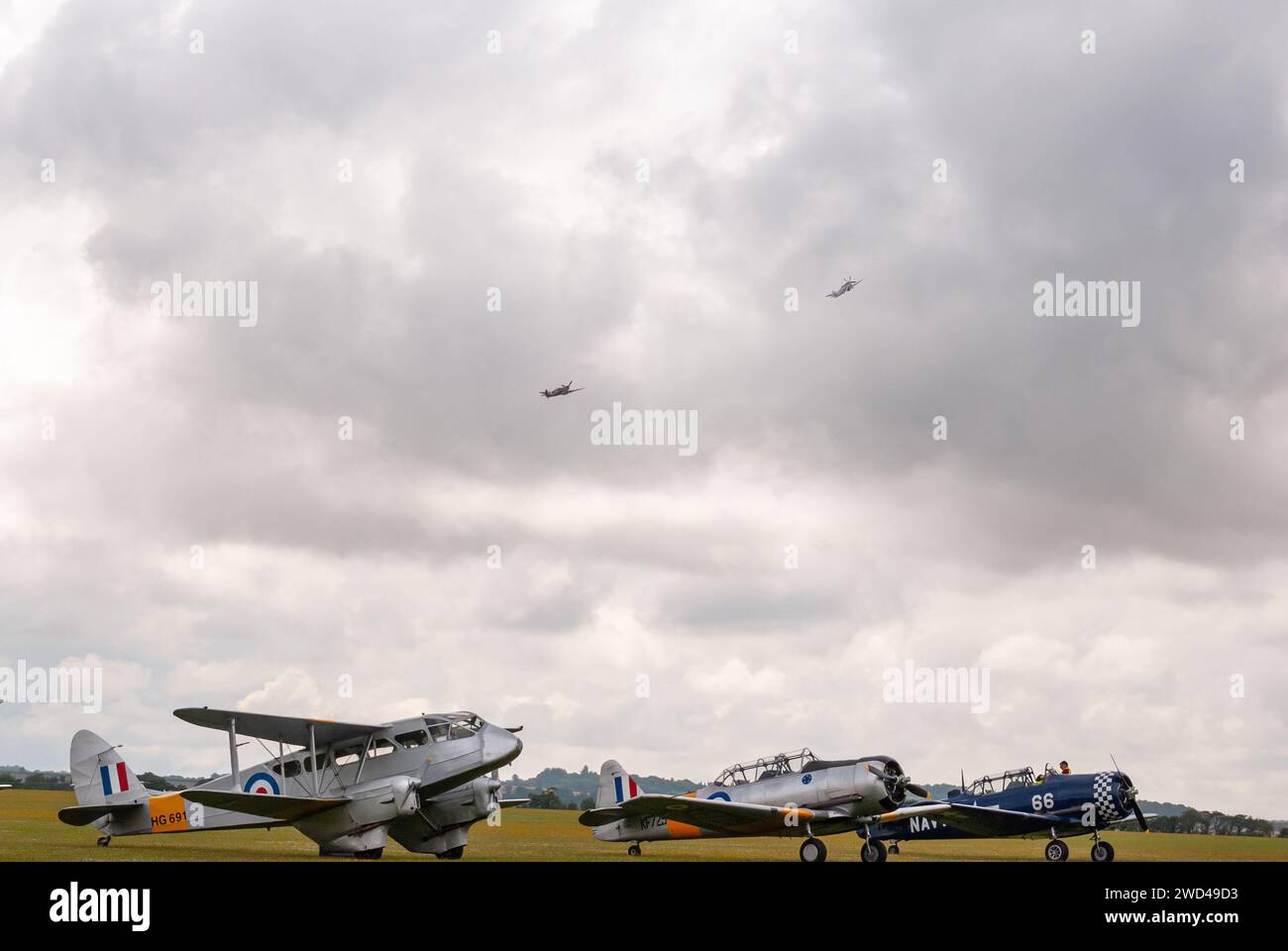 Spitfire formation dogfight in the clouds at flying legends airshow in ...