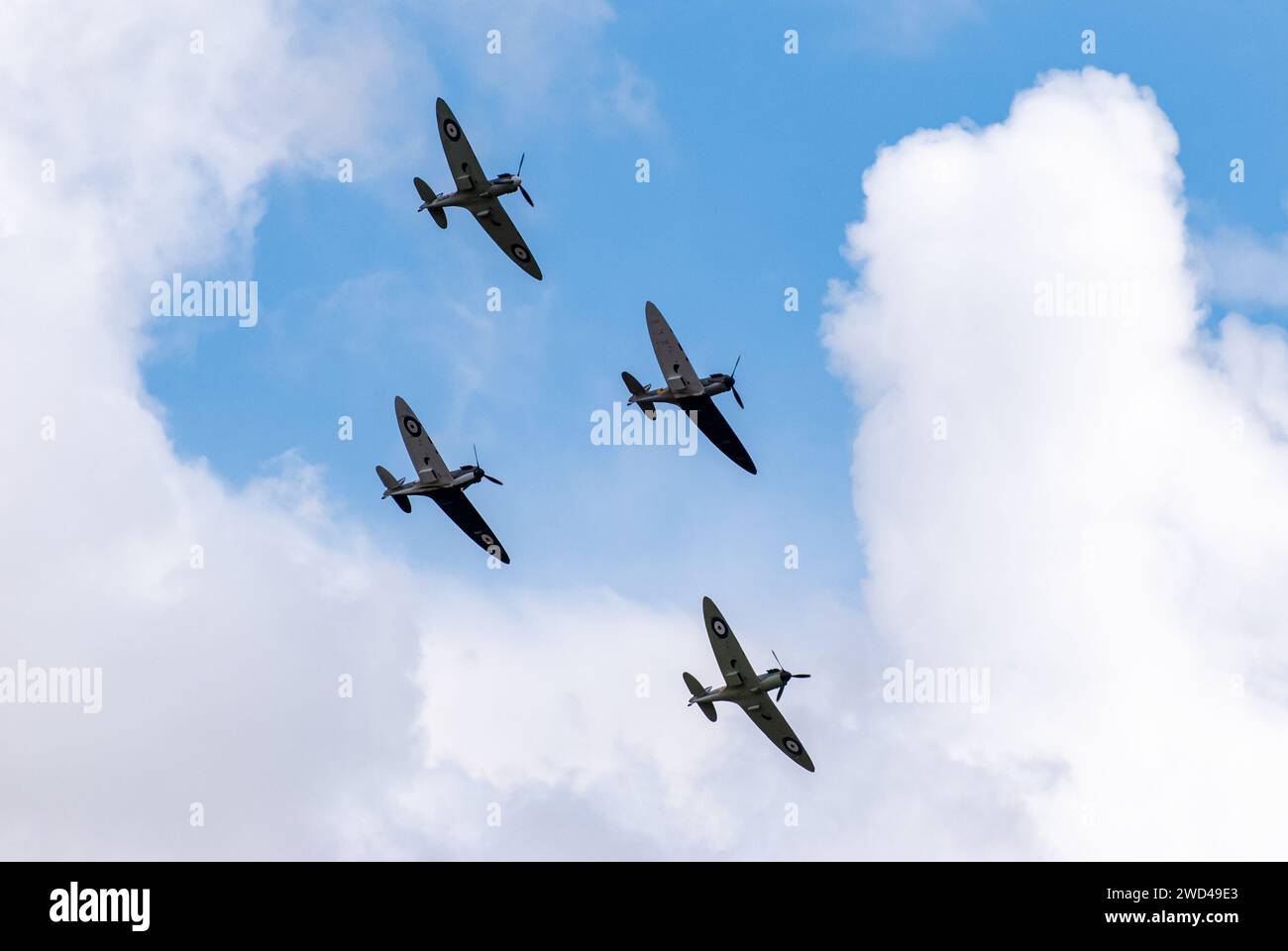 Spitfire formation dogfight in the clouds at flying legends airshow in ...
