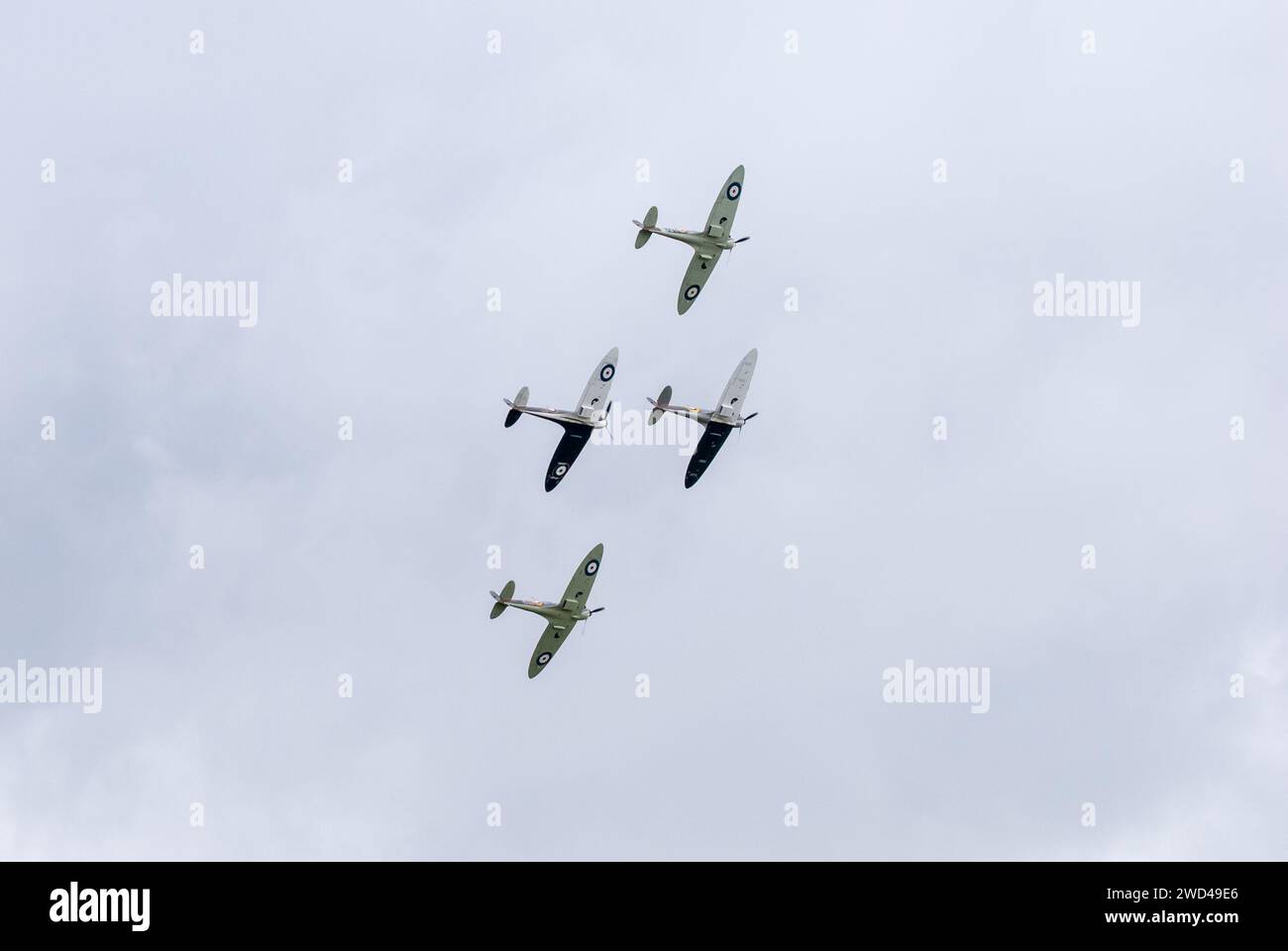 Spitfire formation dogfight in the clouds at flying legends airshow in ...