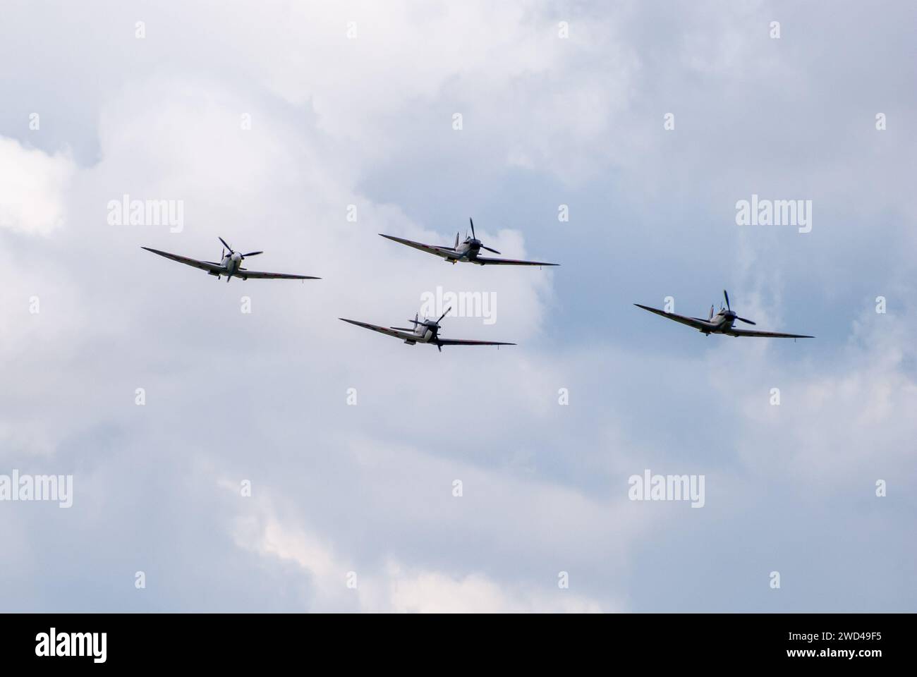 Spitfire formation dogfight in the clouds at flying legends airshow in ...