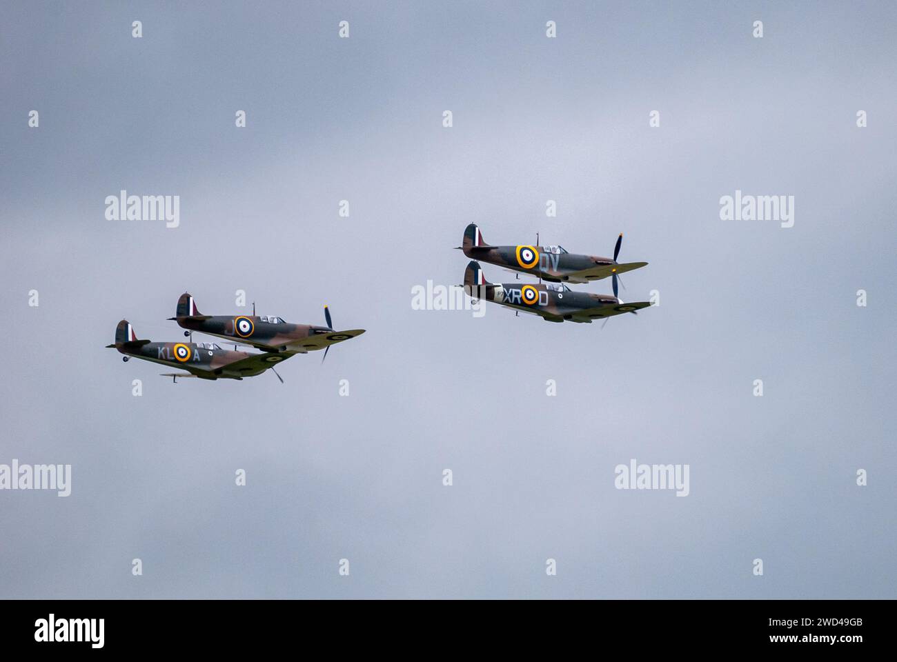 Spitfire formation dogfight in the clouds at flying legends airshow in ...