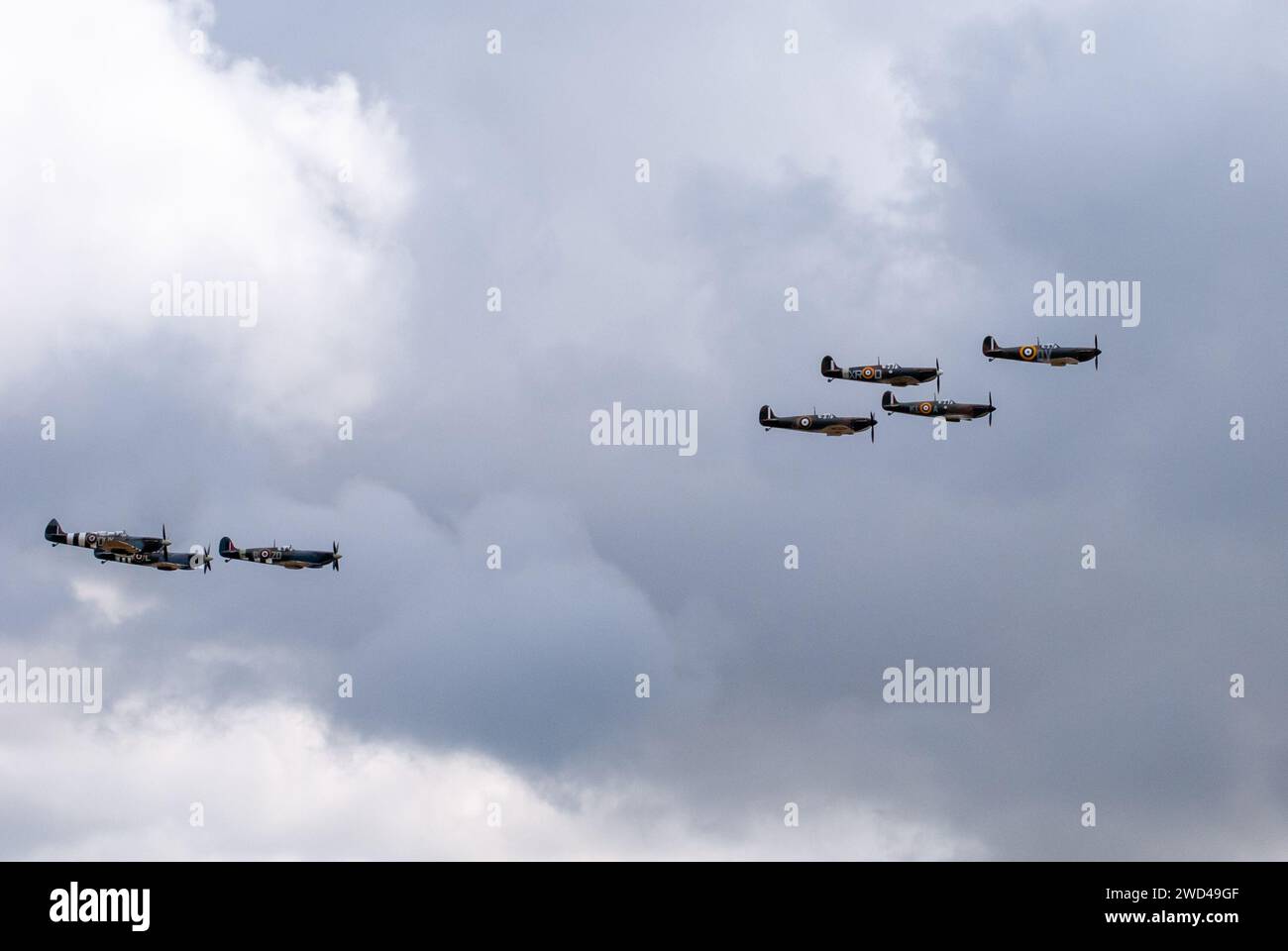 Spitfire formation dogfight in the clouds at flying legends airshow in ...