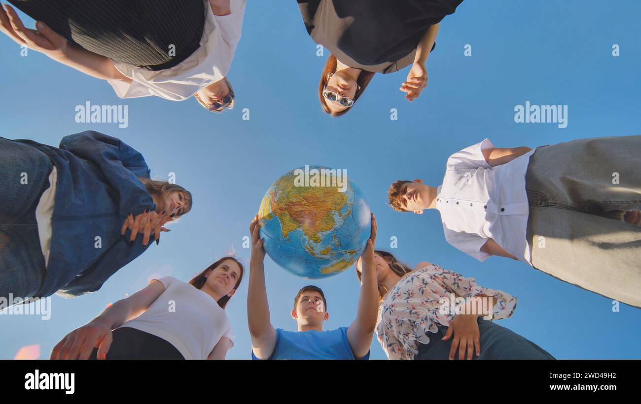 The concept of keeping the world safe. Friends holding a geographical ...