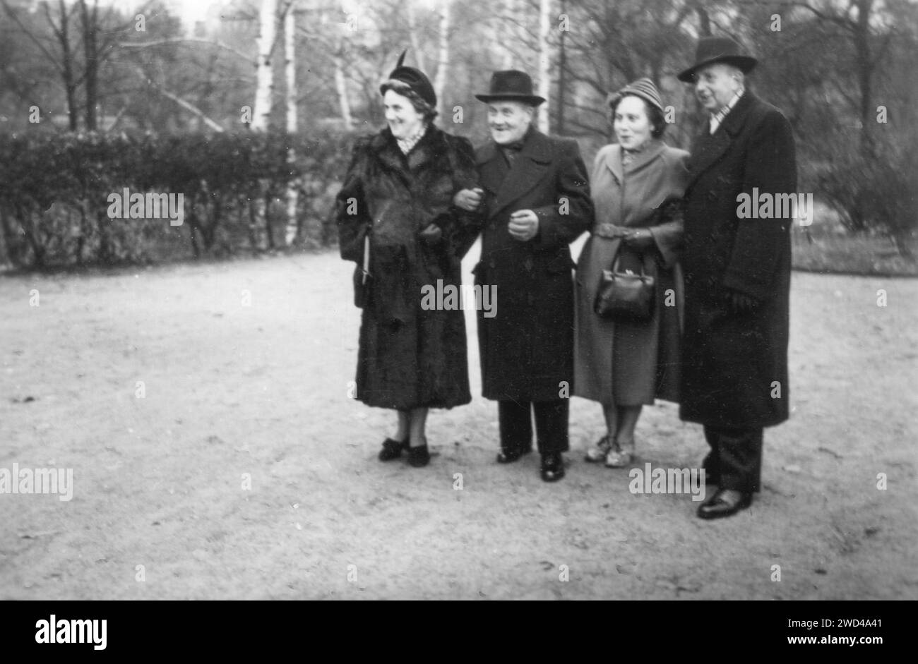 An antique photo shows two middle-aged couples posing outdoors. Germany ...