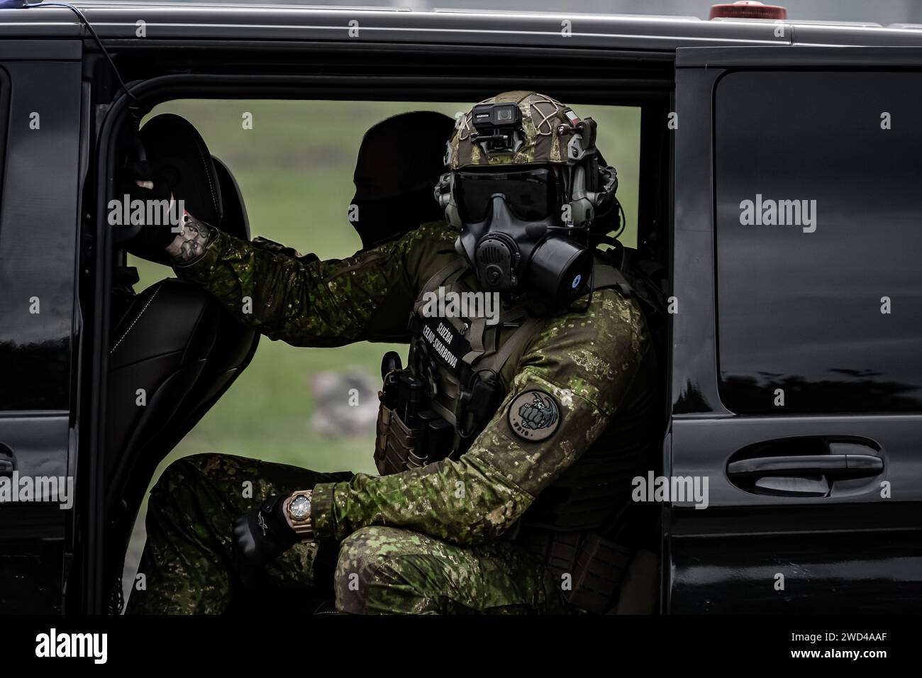 Special forces soldier in black Mercedes van. Tactical uniform worn by ...