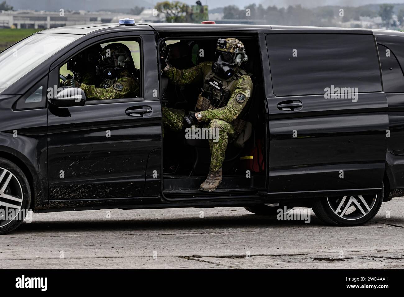 Special forces soldier in black Mercedes van. Tactical uniform worn by ...