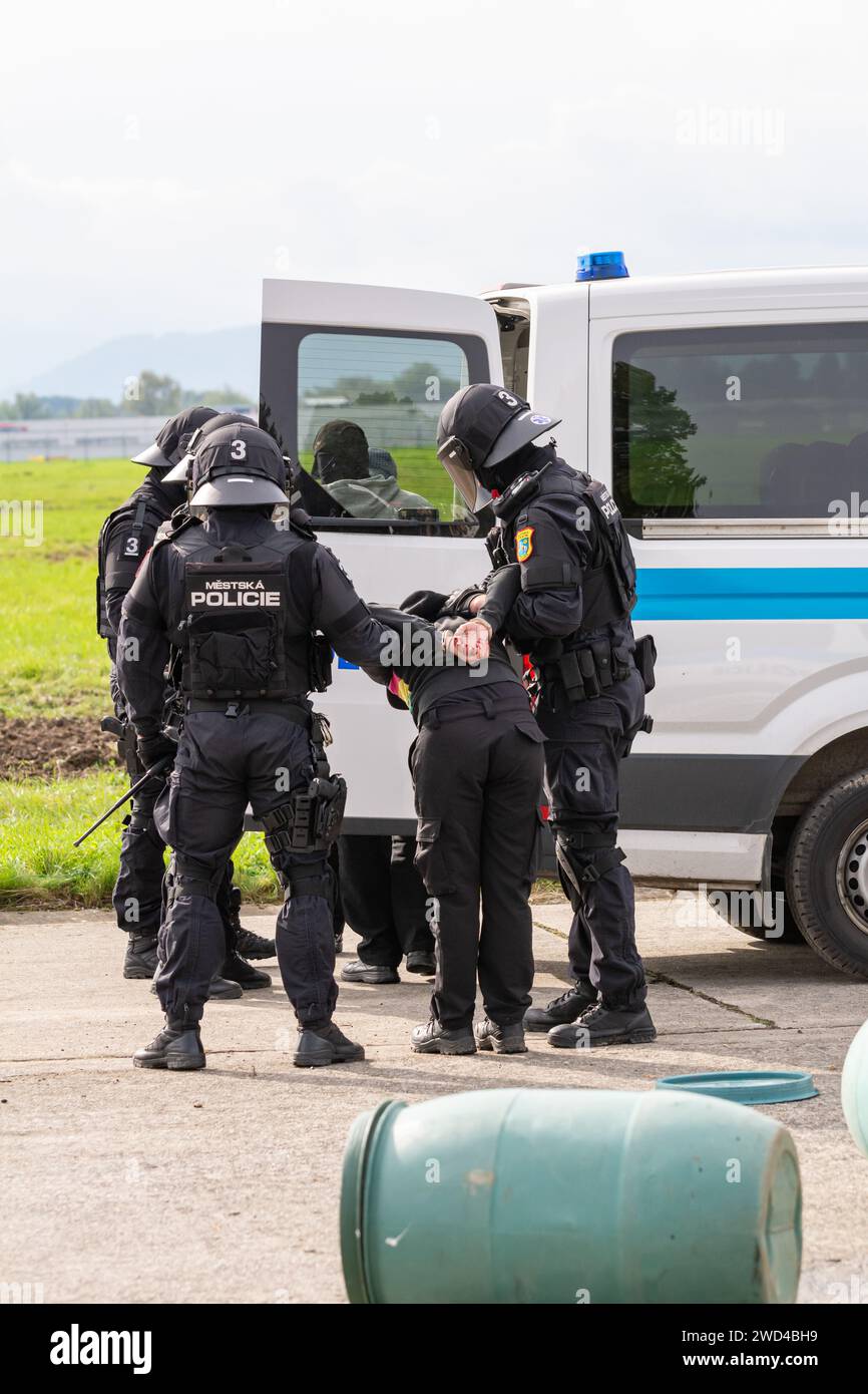 Police officers arresting protesters during a riot. Czech Republic city ...