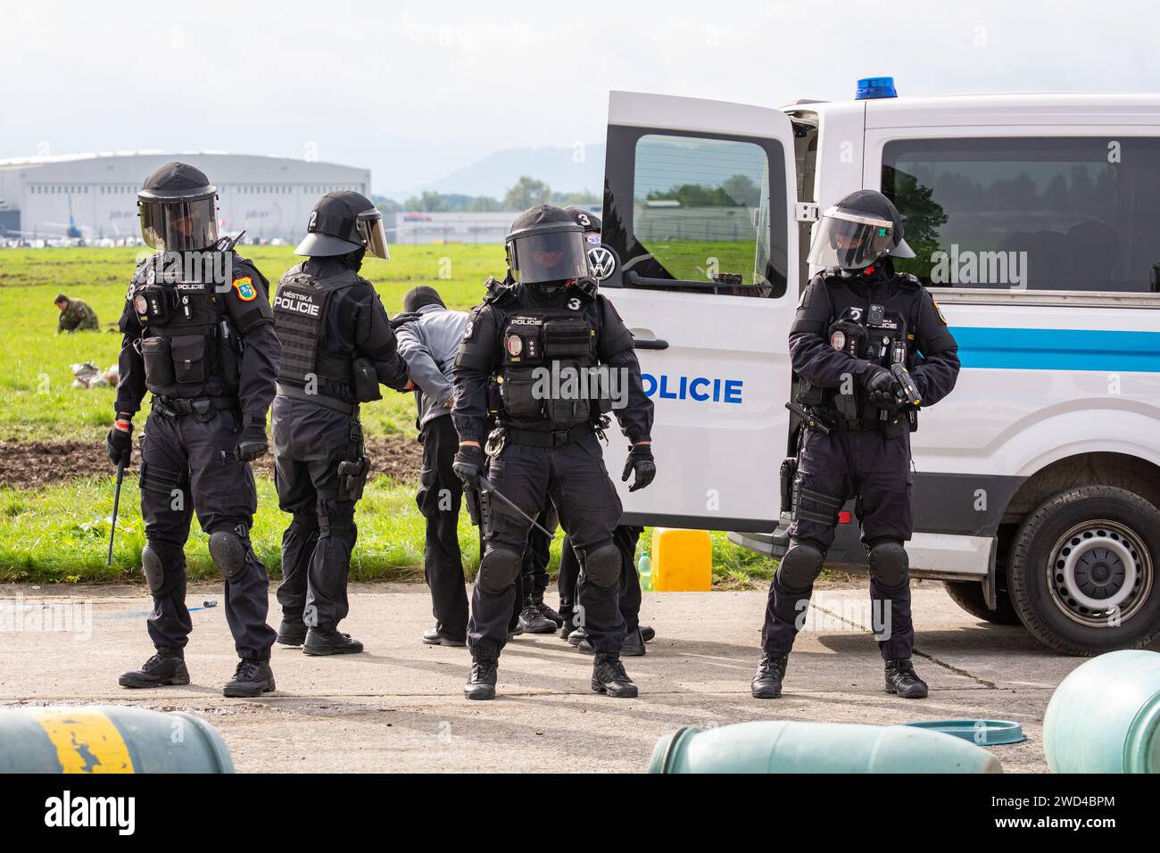 Police officers arresting protesters during a riot. Czech Republic city ...