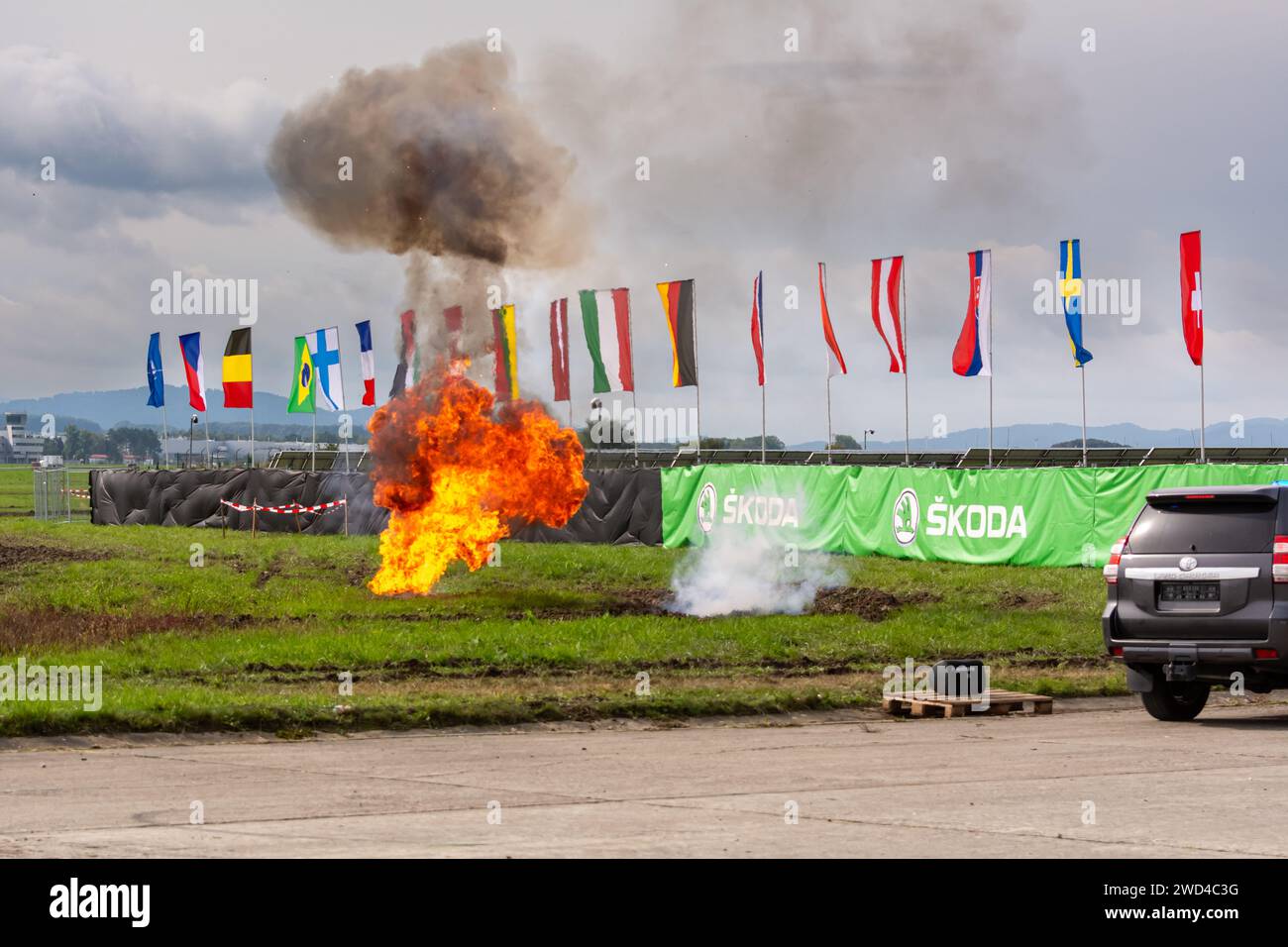 Fireball in front of NATO flags during a training demonstration at NATO ...