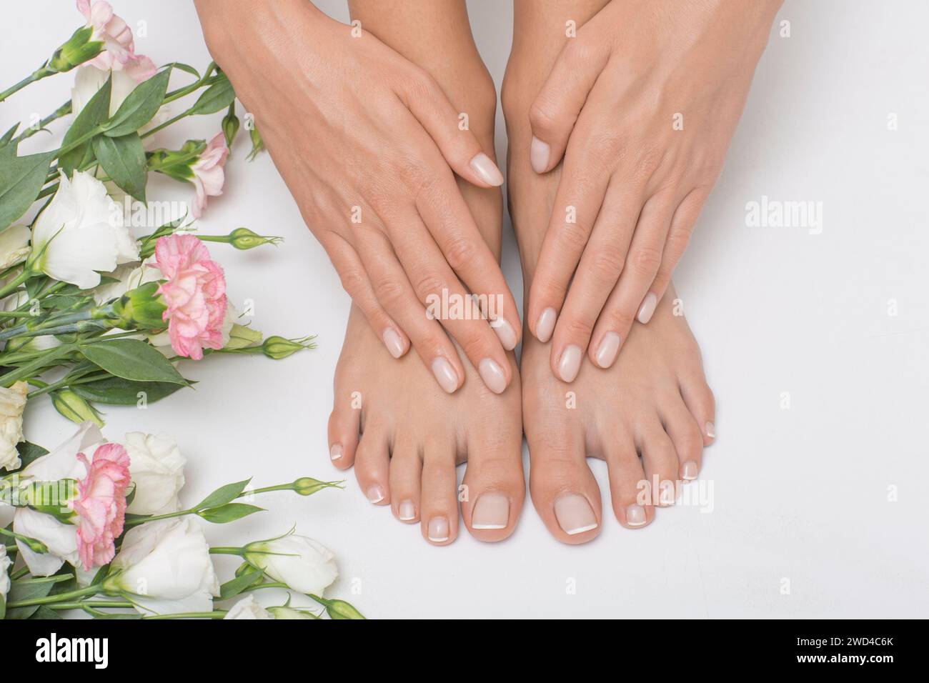 The picture of ideal done manicure and pedicure. Female hands and legs ...