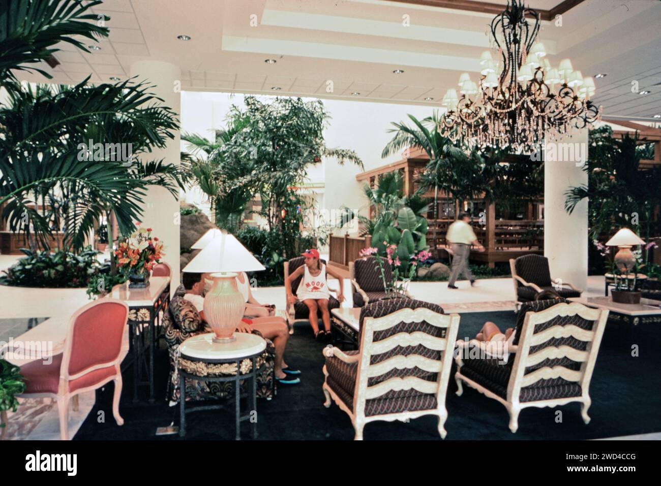 Tourists at the Marriot Ocean Club in Aruba; lobby interior ca. Late ...