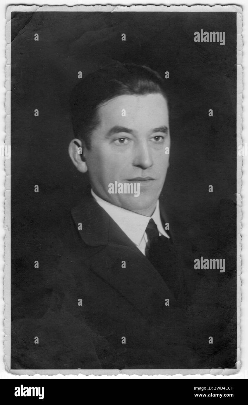Antique photo studio portrait of a man in a business suit. Oppeln ...