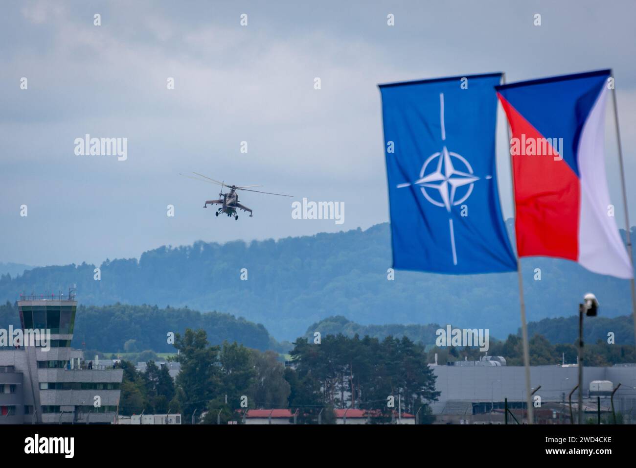 Russian made Mi-24 Hind Helicopter gunship flying behind a NATO and ...