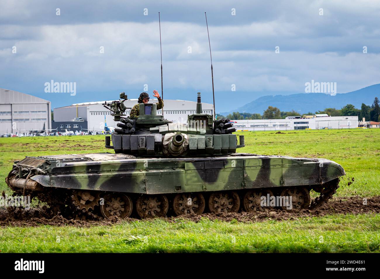 T72 Tank (M4 CZ Variant number 029) driving on a muddy field in front ...