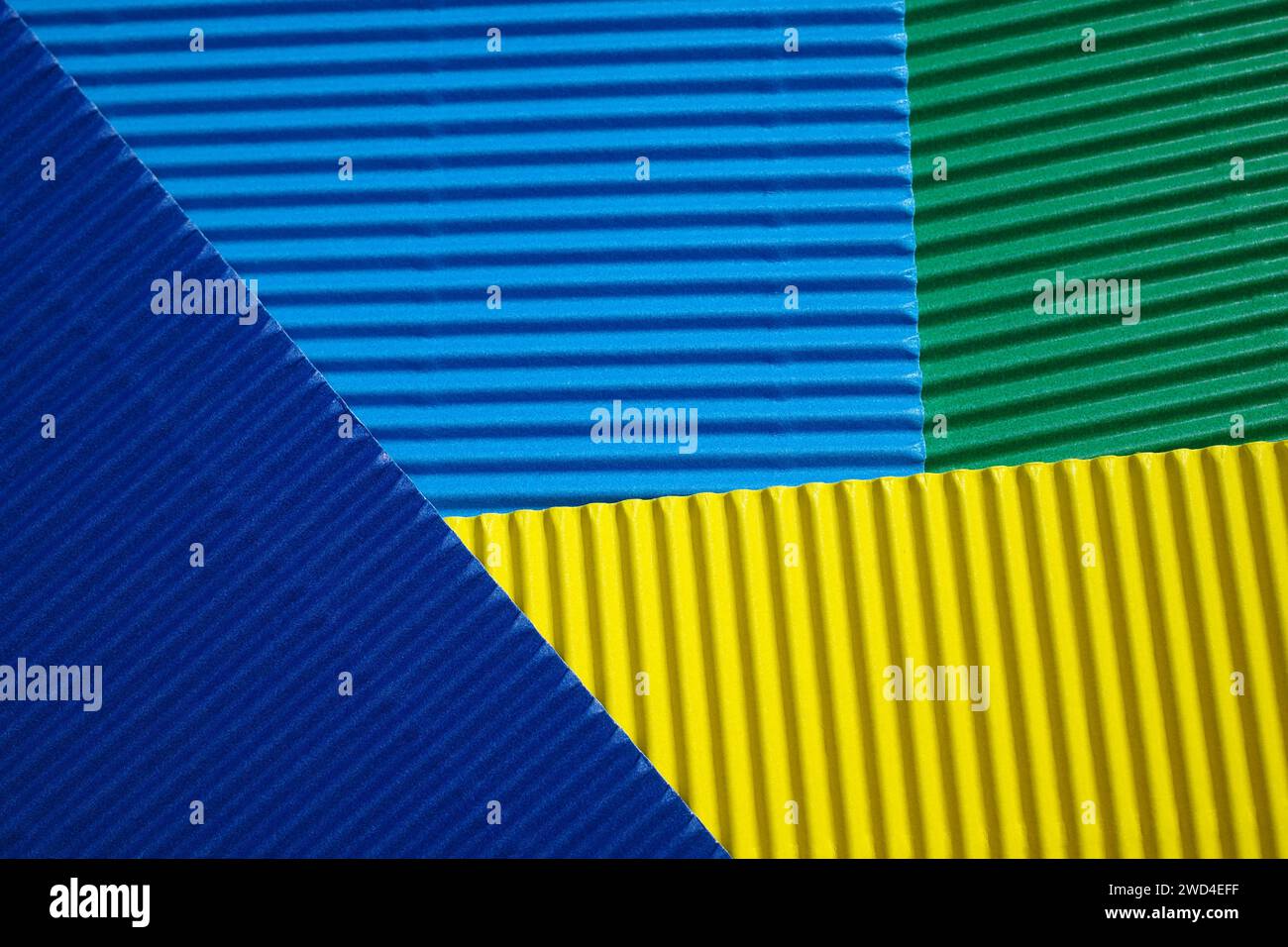 Horizontally and diagonally ribbed cardboard with the colors green ...