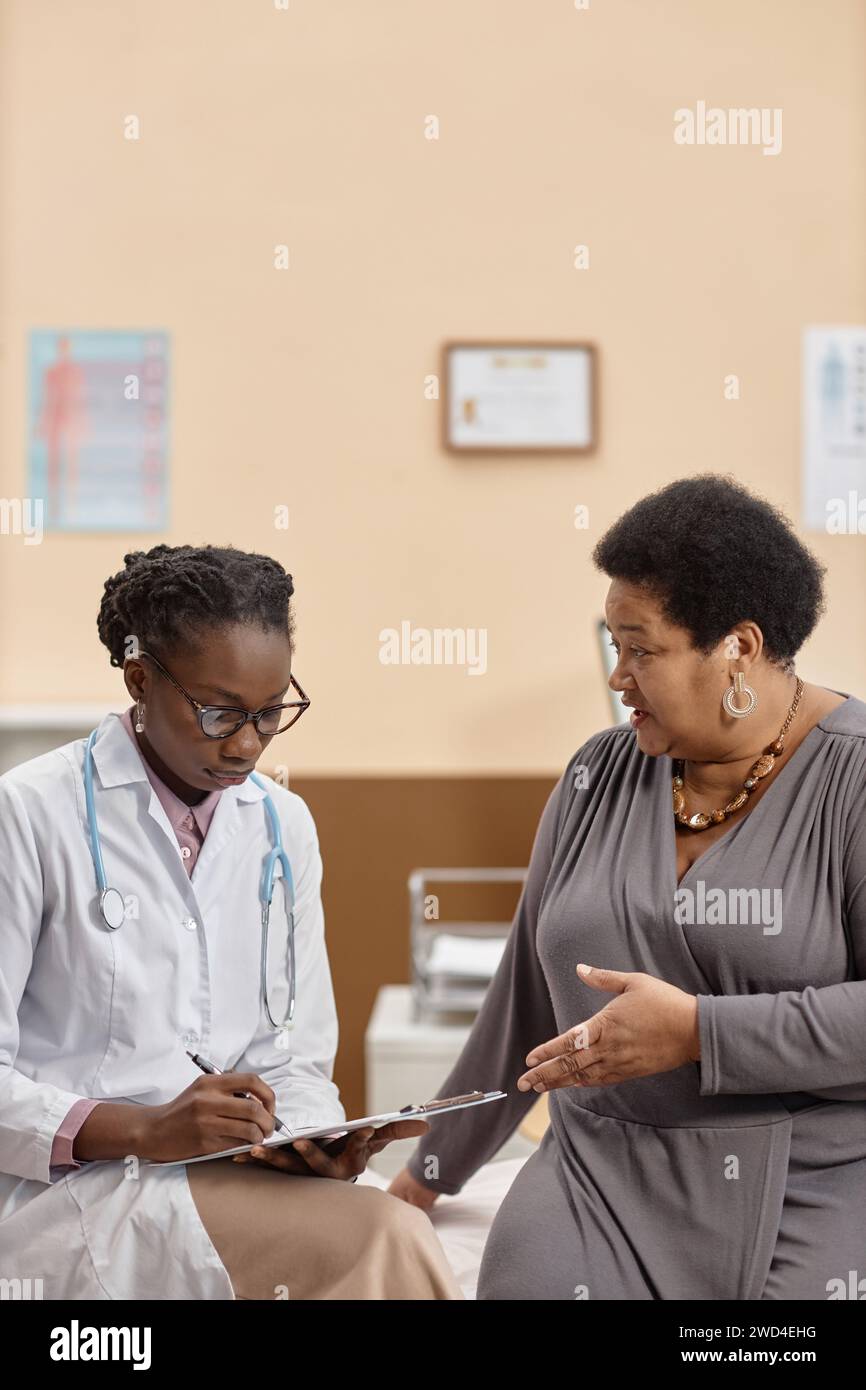 Female Patient Explaining Symptoms to Physician Stock Photo - Alamy