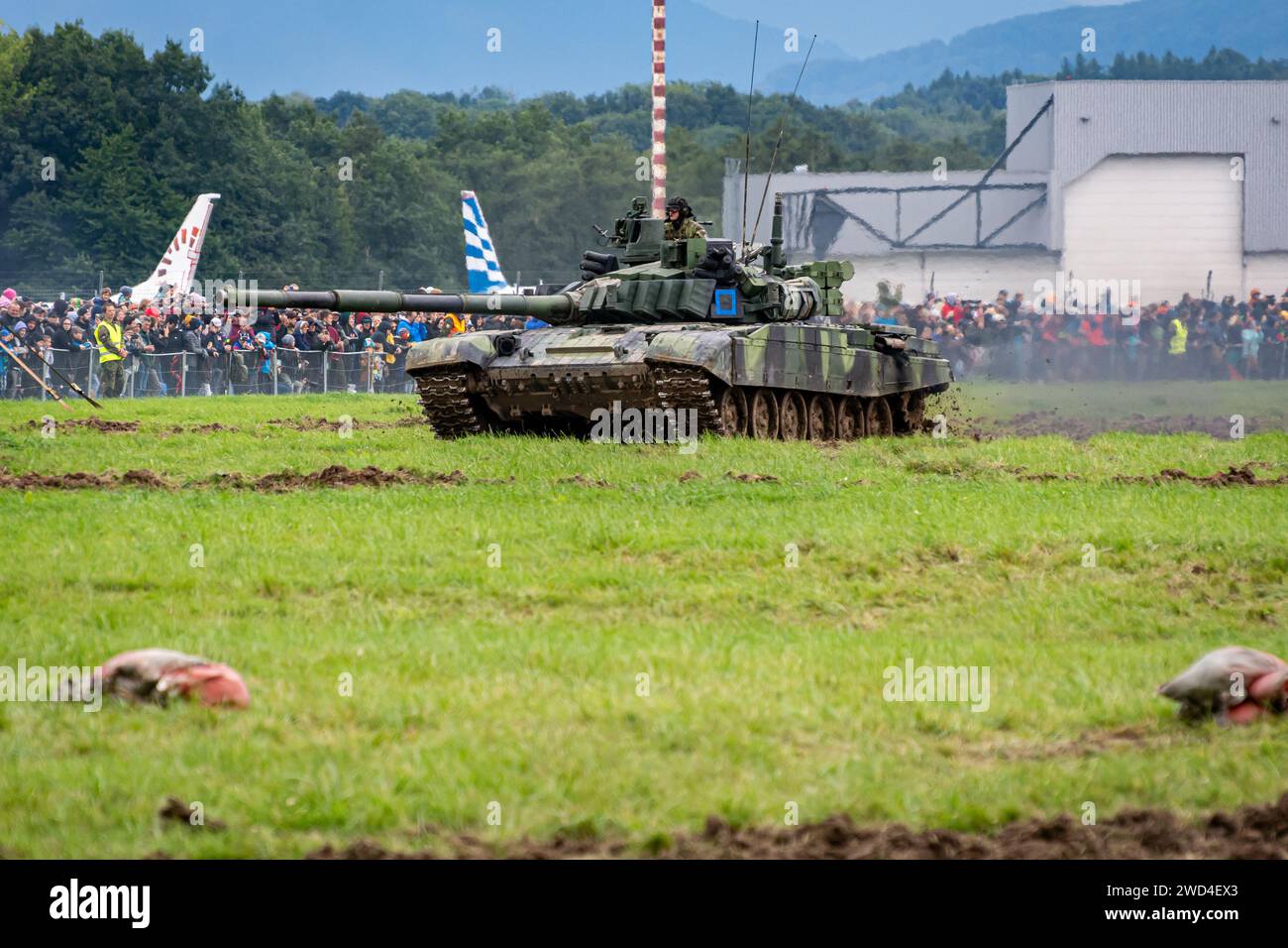 T72 Tank (M4 CZ Variant number 029) driving on a muddy field in front ...