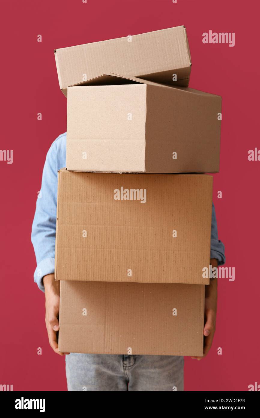 Delivery man many parcels hi-res stock photography and images - Alamy