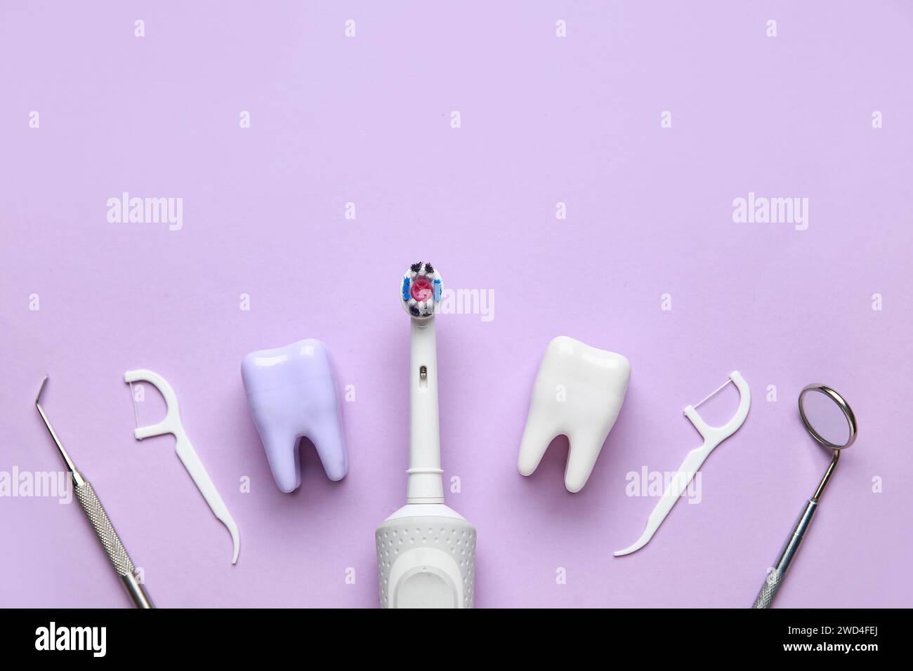 Plastic tooth models, electric toothbrush, floss toothpicks and dental ...