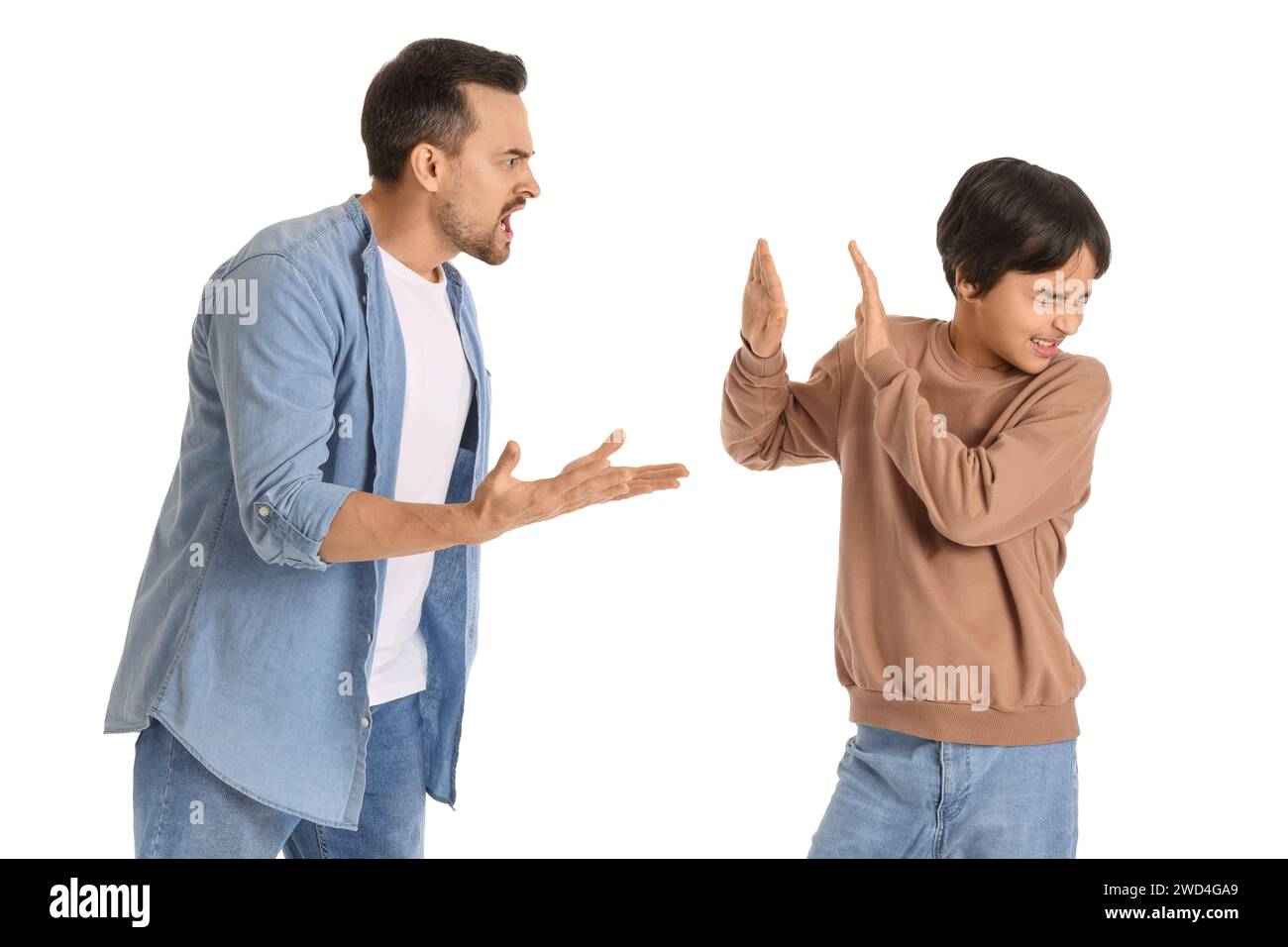 Angry father shouting at his teenage son on white background. Family ...